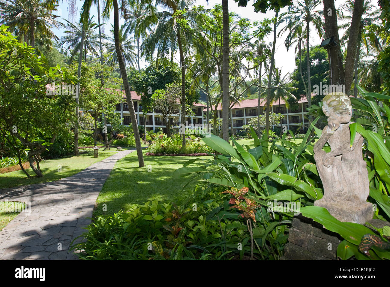 Stone statue in the gardens of the Sheraton Hotel near Senggigi, Lombok ...