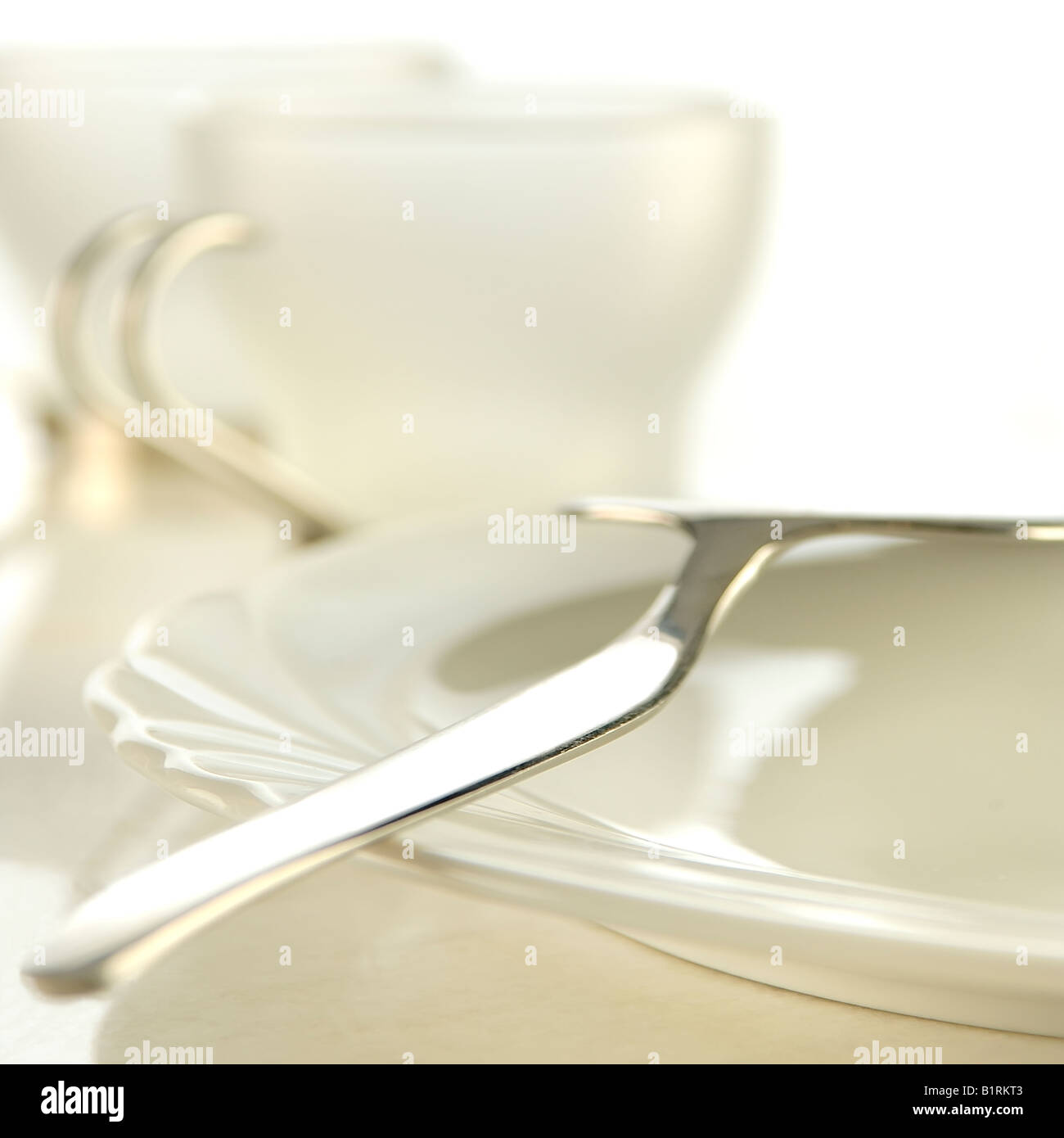An elegant table place setting in white Stock Photo - Alamy