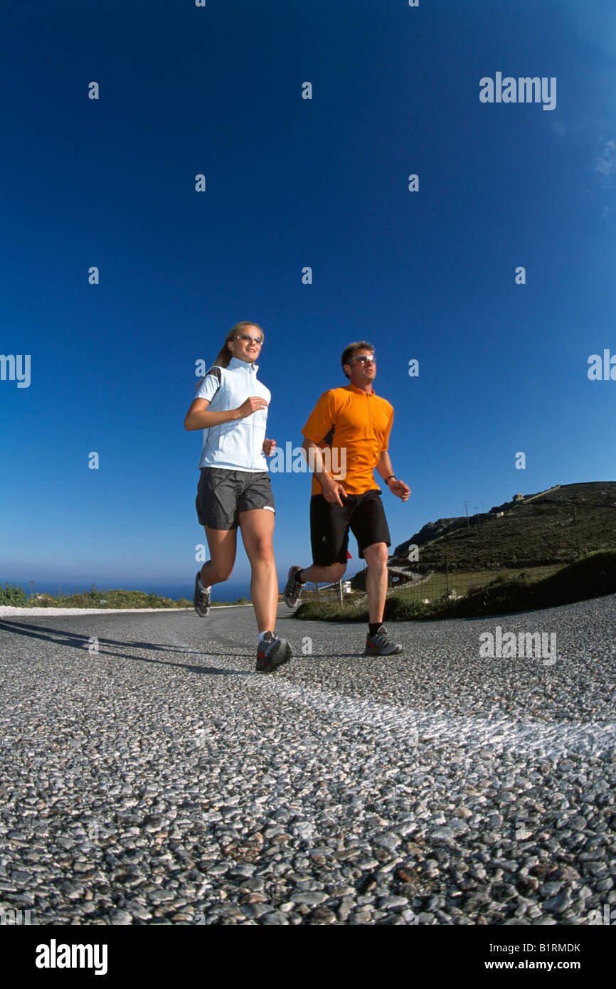 Couple runs on road hi-res stock photography and images - Alamy