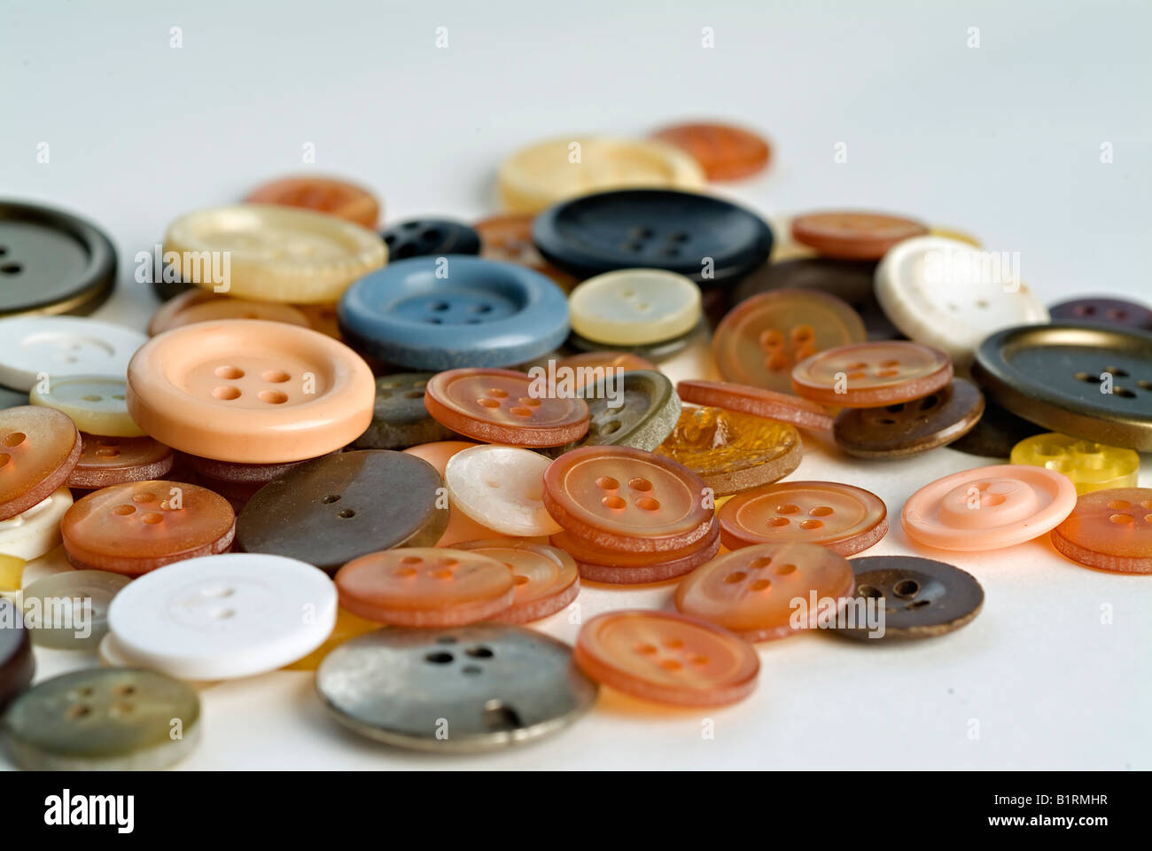 multi color and shape buttons on white Stock Photo - Alamy