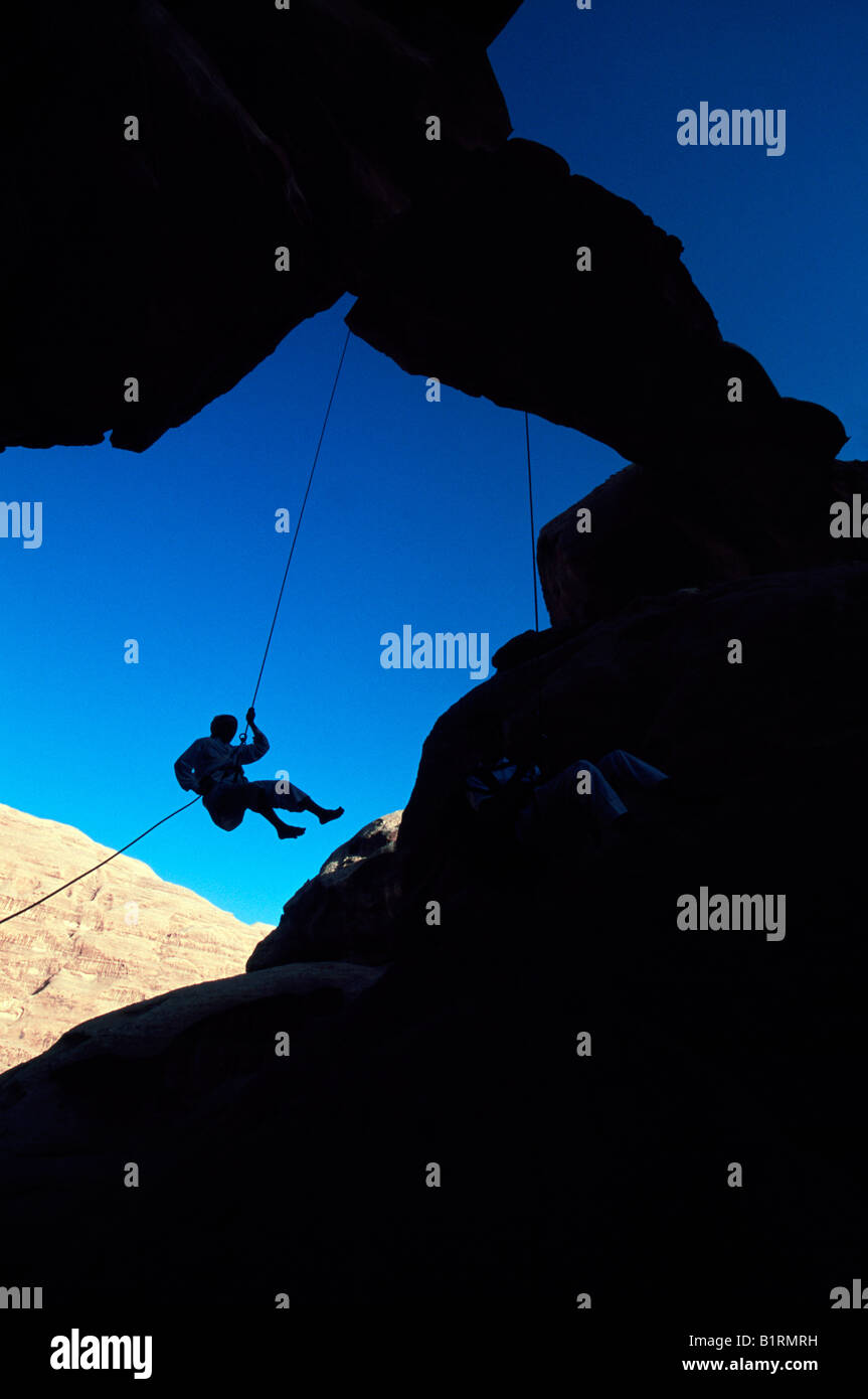 Climbing, stone arch, Wadi Rum, Jordan, Asia Stock Photo - Alamy