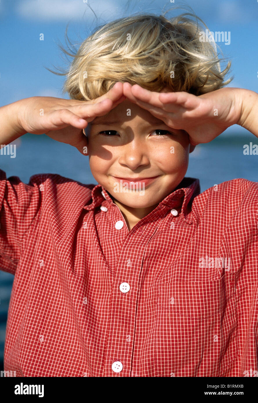 Boy looking into the distance Stock Photo - Alamy