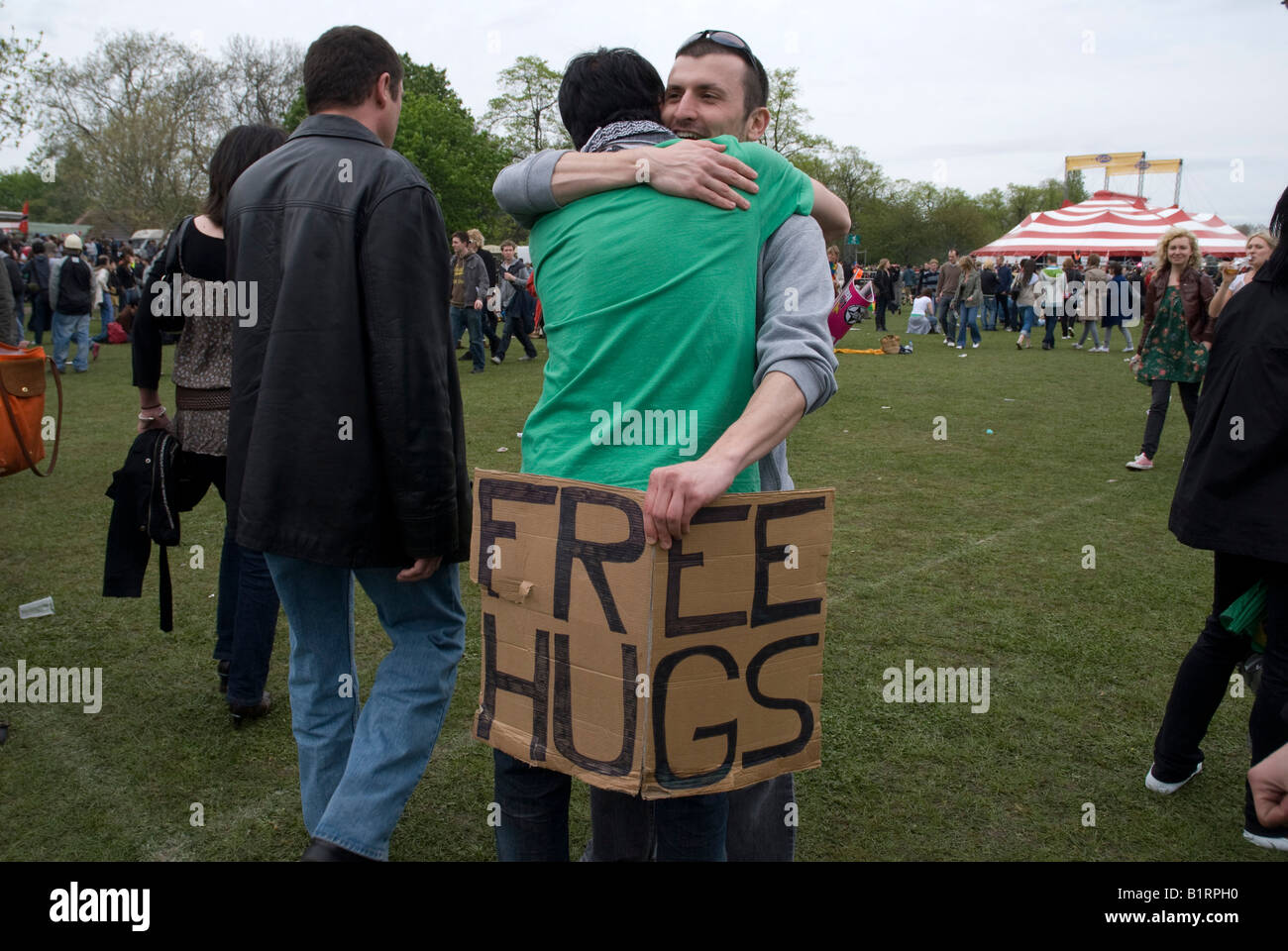 A man offering free hugs at a Music festival held at Victoria park ...