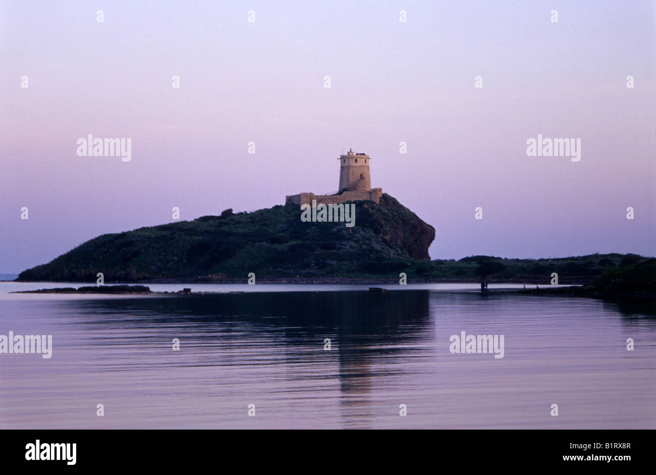 Sunset at Nora,The Tower at Nora,it's reflection in the rippling water ...