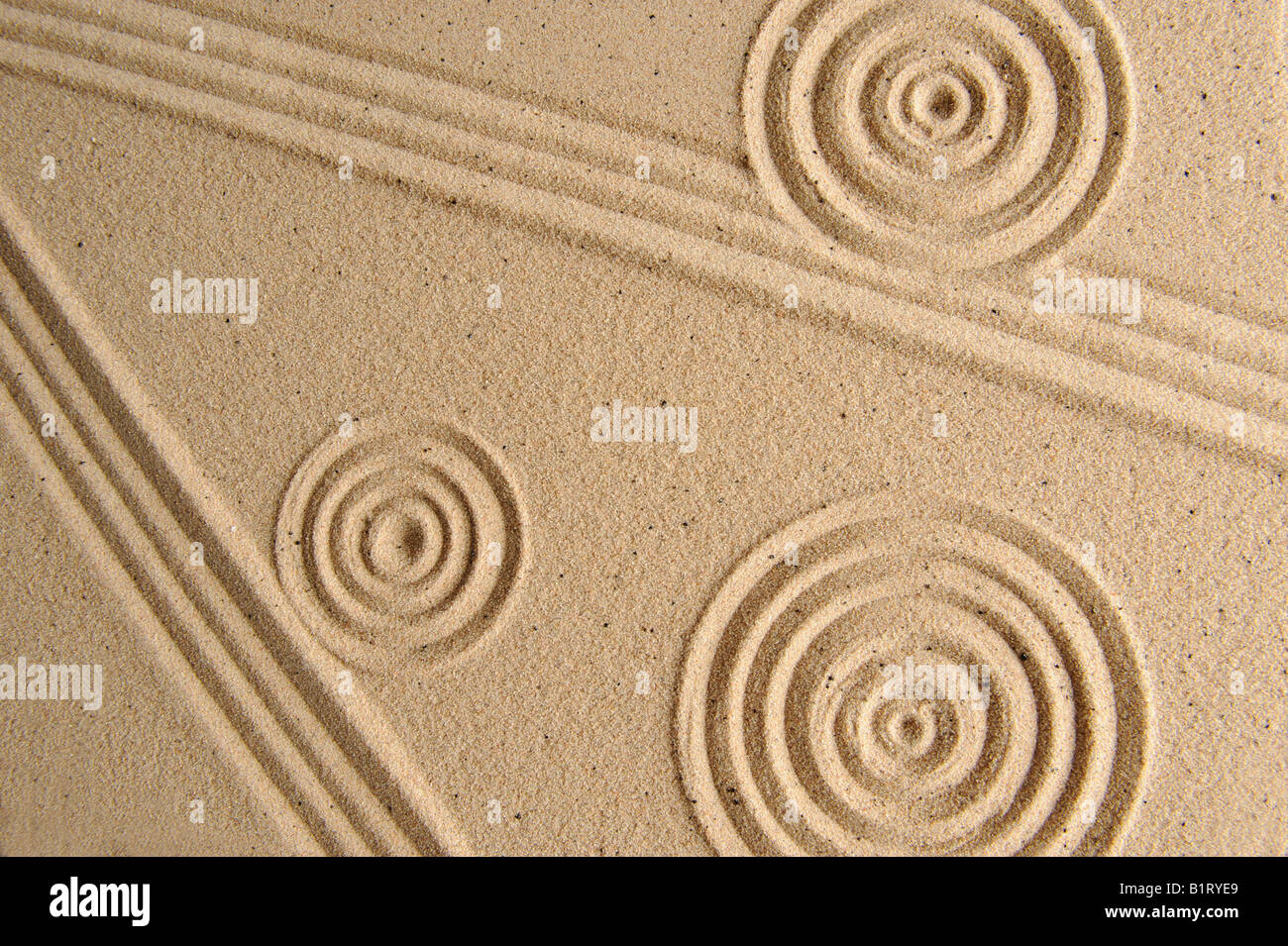 Sand texture, patterns drawn in sand Stock Photo - Alamy