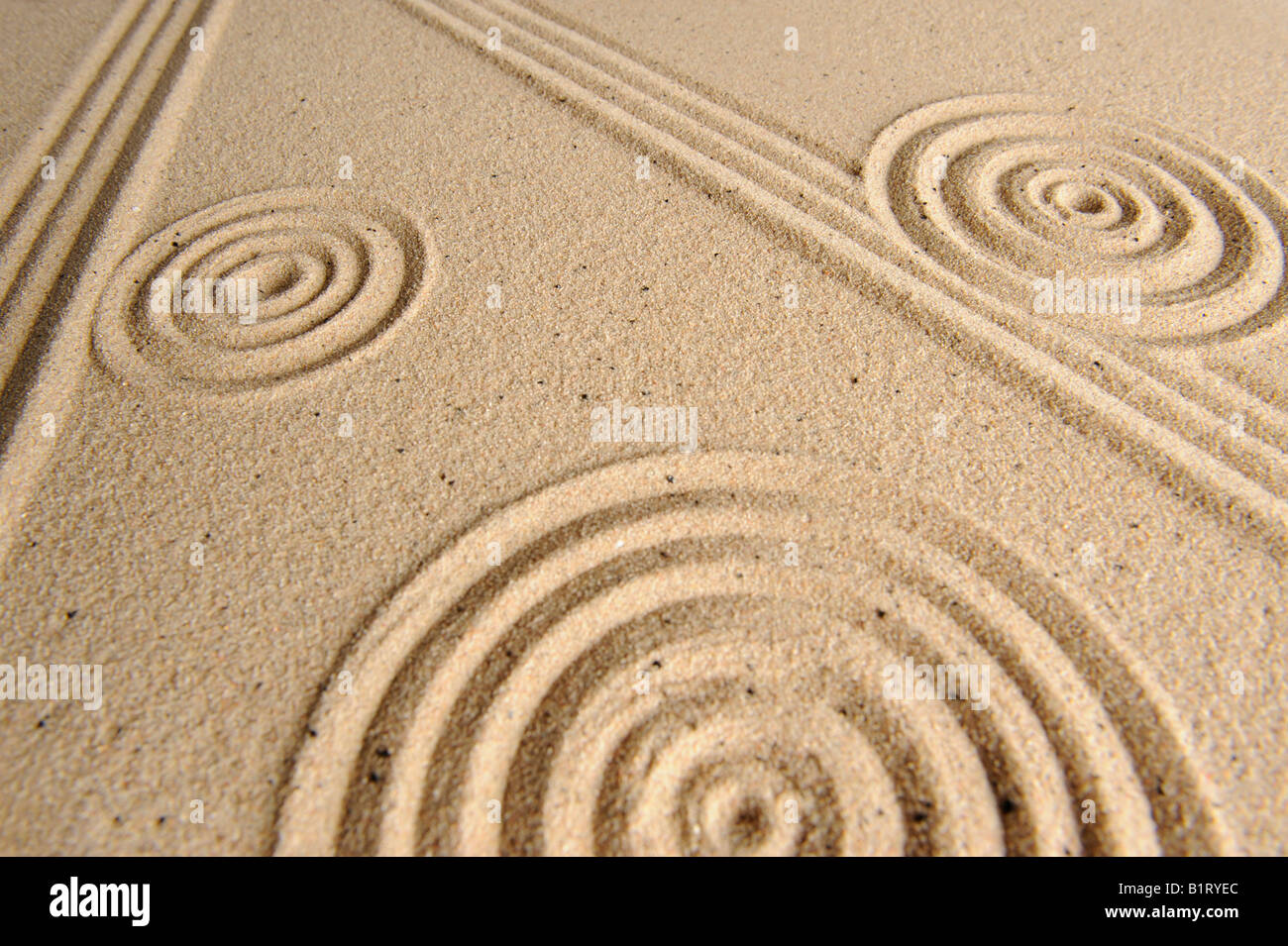 Sand texture, patterns drawn in sand Stock Photo - Alamy