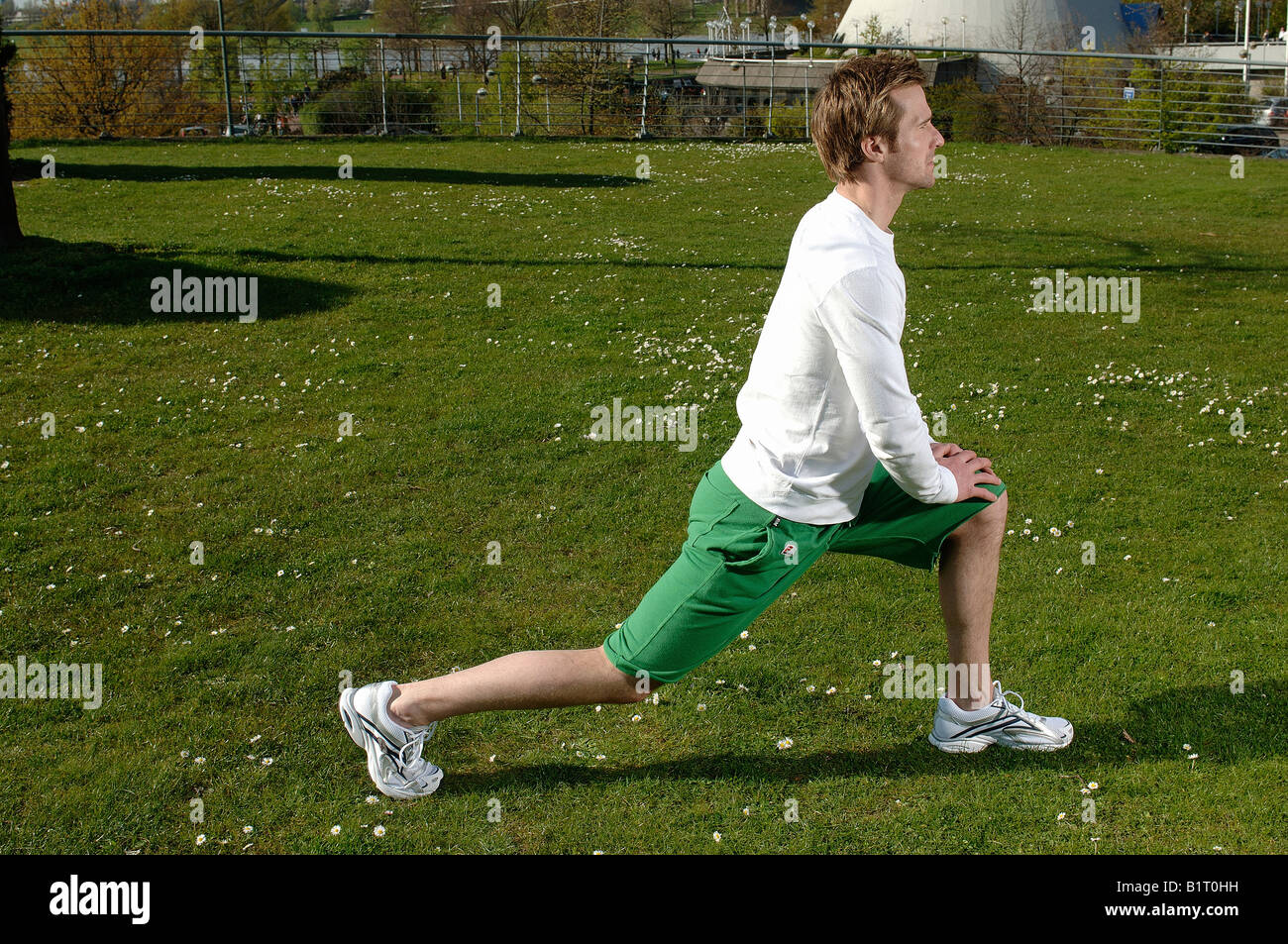 33-year-old man stretching Stock Photo - Alamy