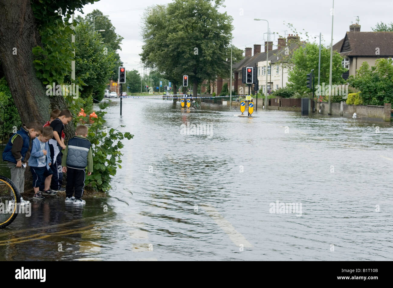 Children playing in flood water hi-res stock photography and images - Alamy