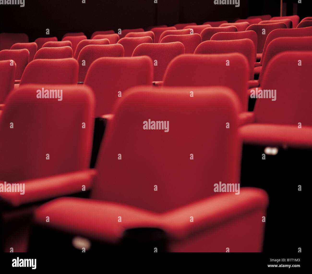 red cinema style seating Stock Photo - Alamy