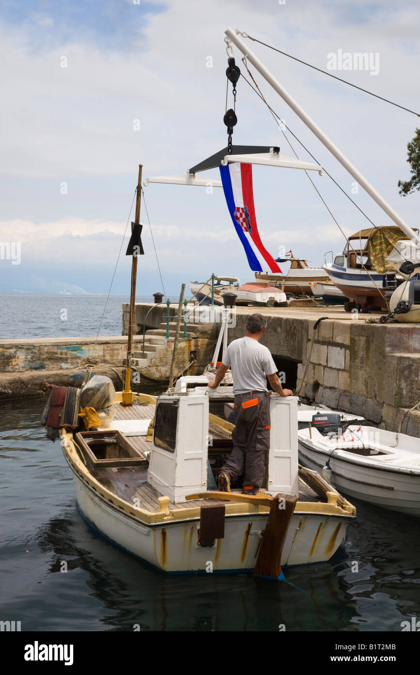 Lovran Istria Croatia Europe Fishing boat by quay in small port harbour ...