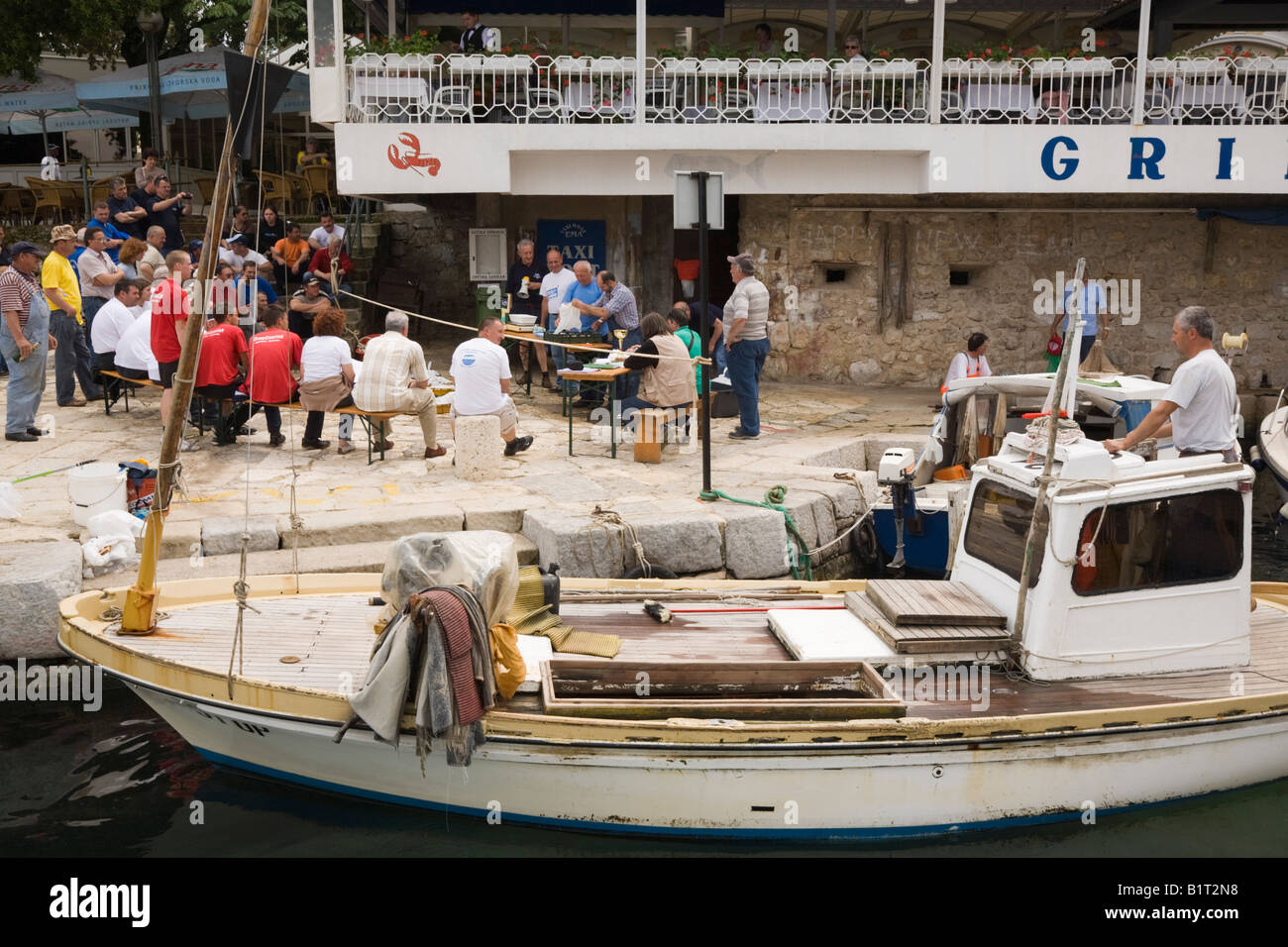 Lovran Istria Croatia Europe Fishing boat by quay in small port harbour ...