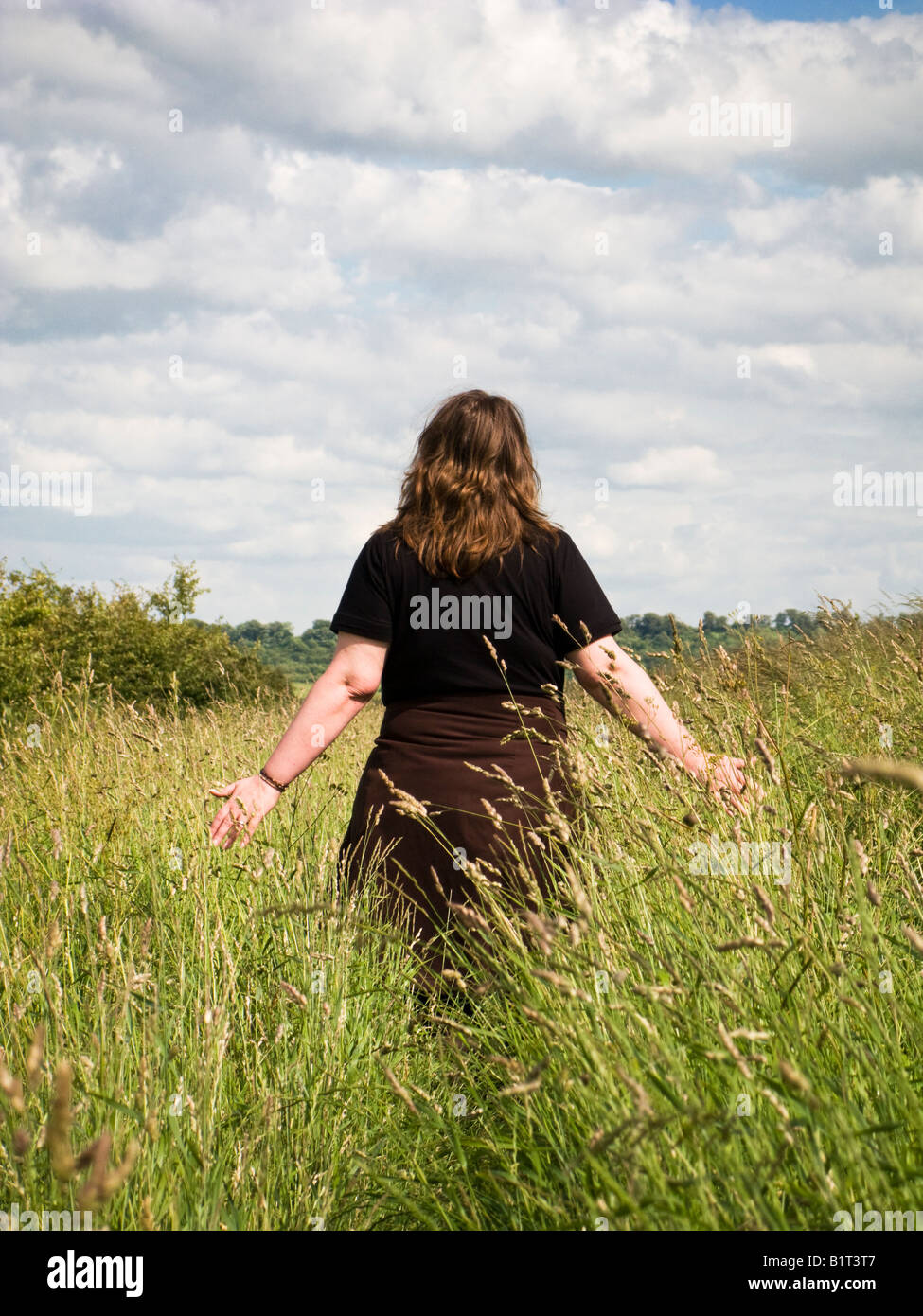 Woman walking among country hi-res stock photography and images - Alamy