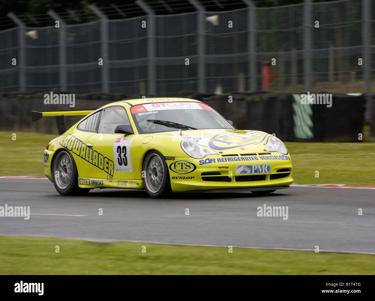 A Porsche 996 GT3 Sports Race Car Exiting Old Hall Corner in GT Cup at ...