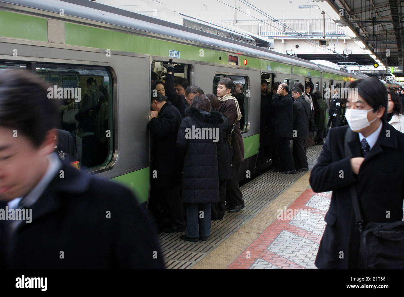 Crowded boarding train japan hi-res stock photography and images - Alamy