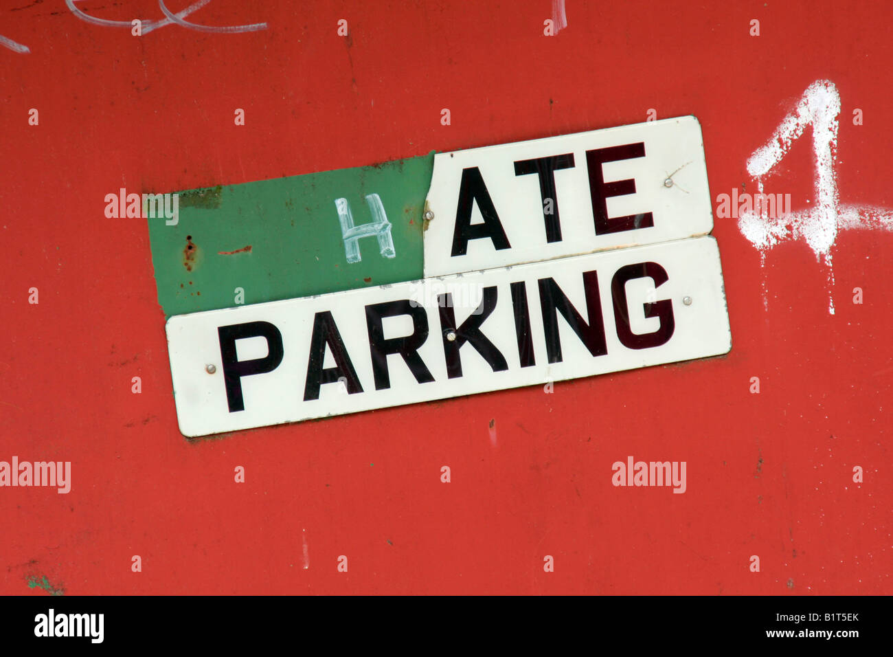 Parking sign defaced to say hate parking Stock Photo - Alamy