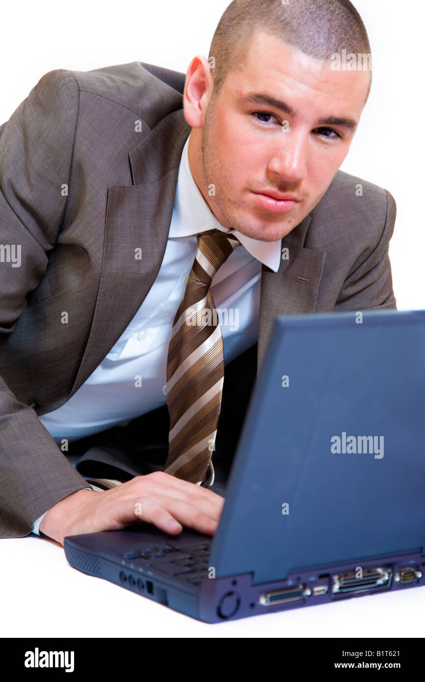 Young businessman using a laptop Stock Photo - Alamy