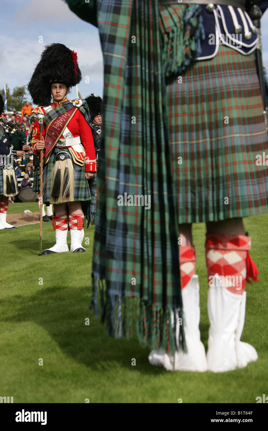 Village of Braemar, Scotland. Female Pipe Major leading her band in the ...
