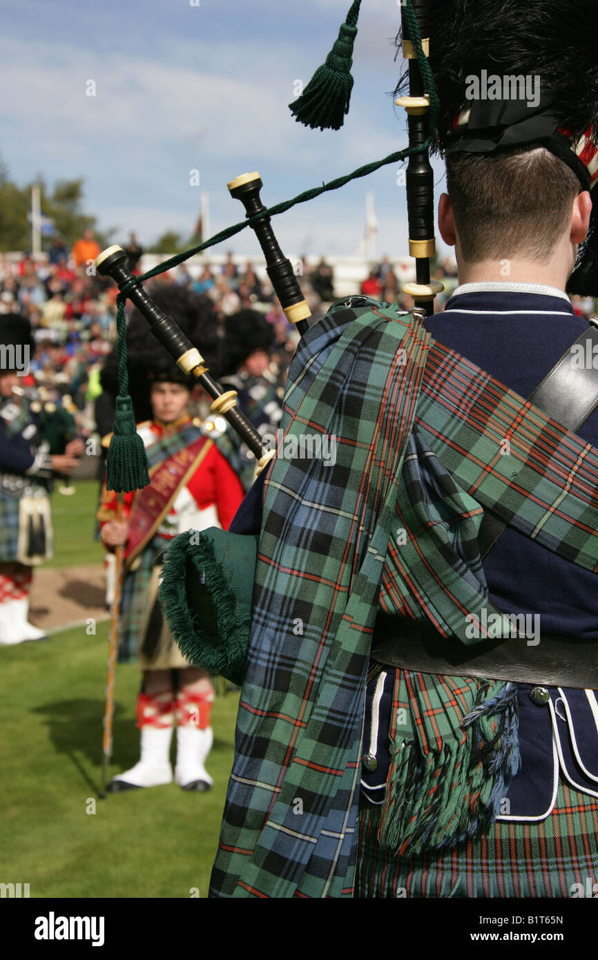Village of Braemar, Scotland. Female Pipe Major leading her band in the ...