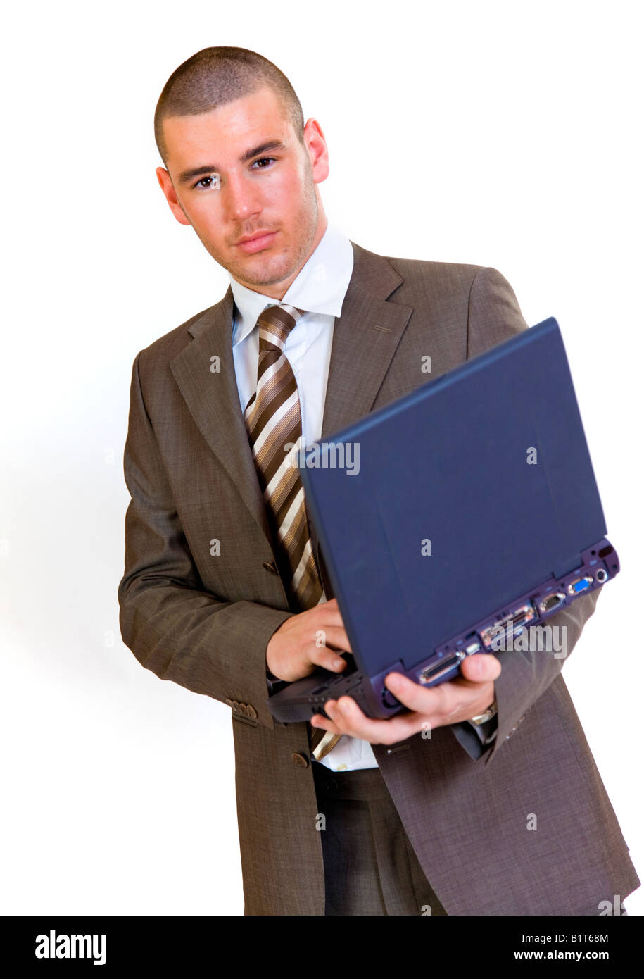Young businessman using a laptop Stock Photo - Alamy