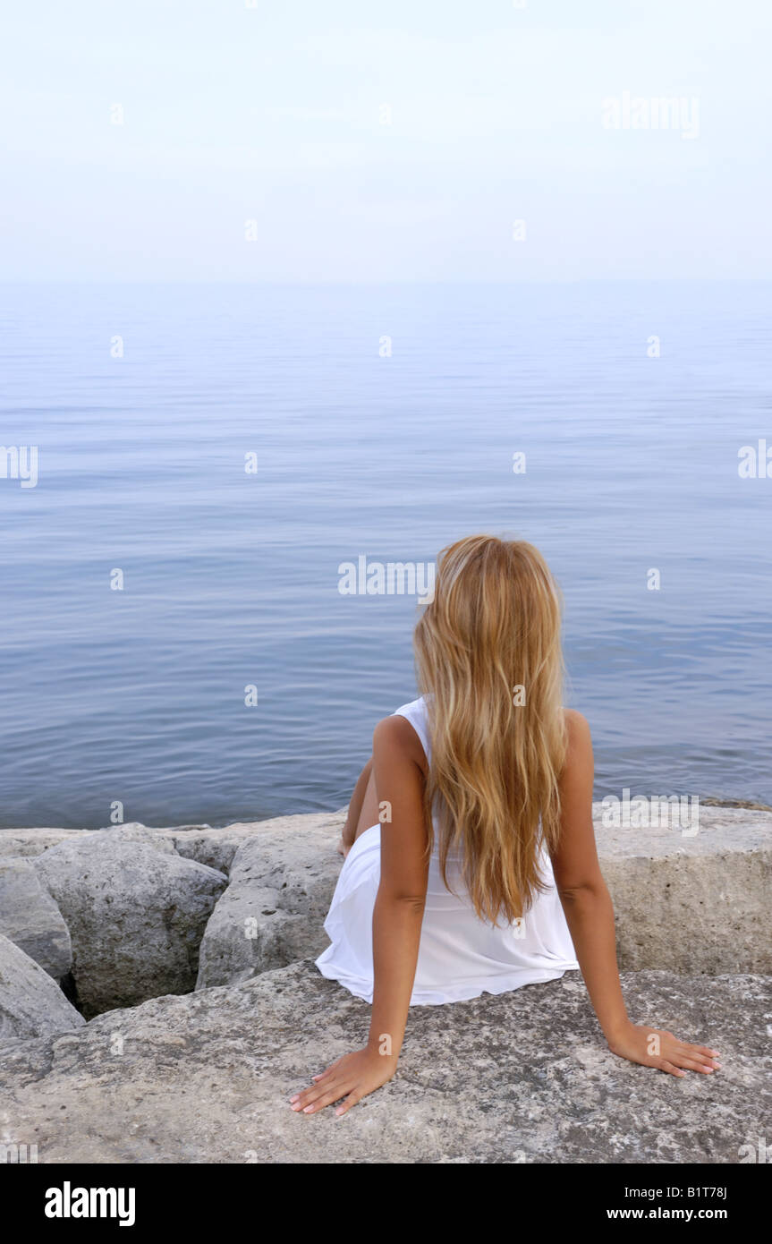 Beautiful woman on a shore Stock Photo - Alamy