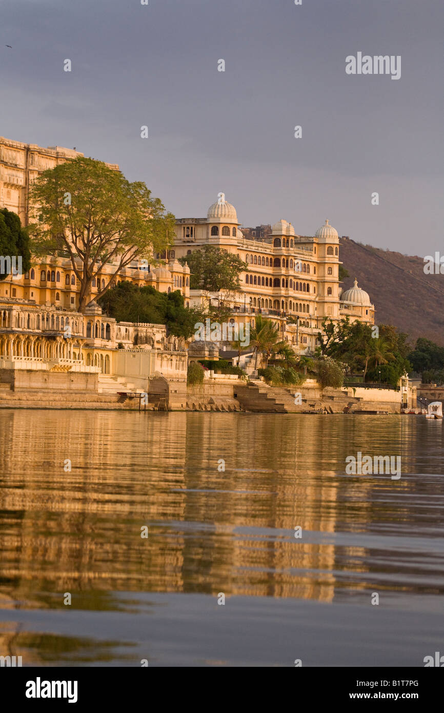 Late afternoon light illuminates the CITY PALACE of UDAIPUR and PICHOLA ...