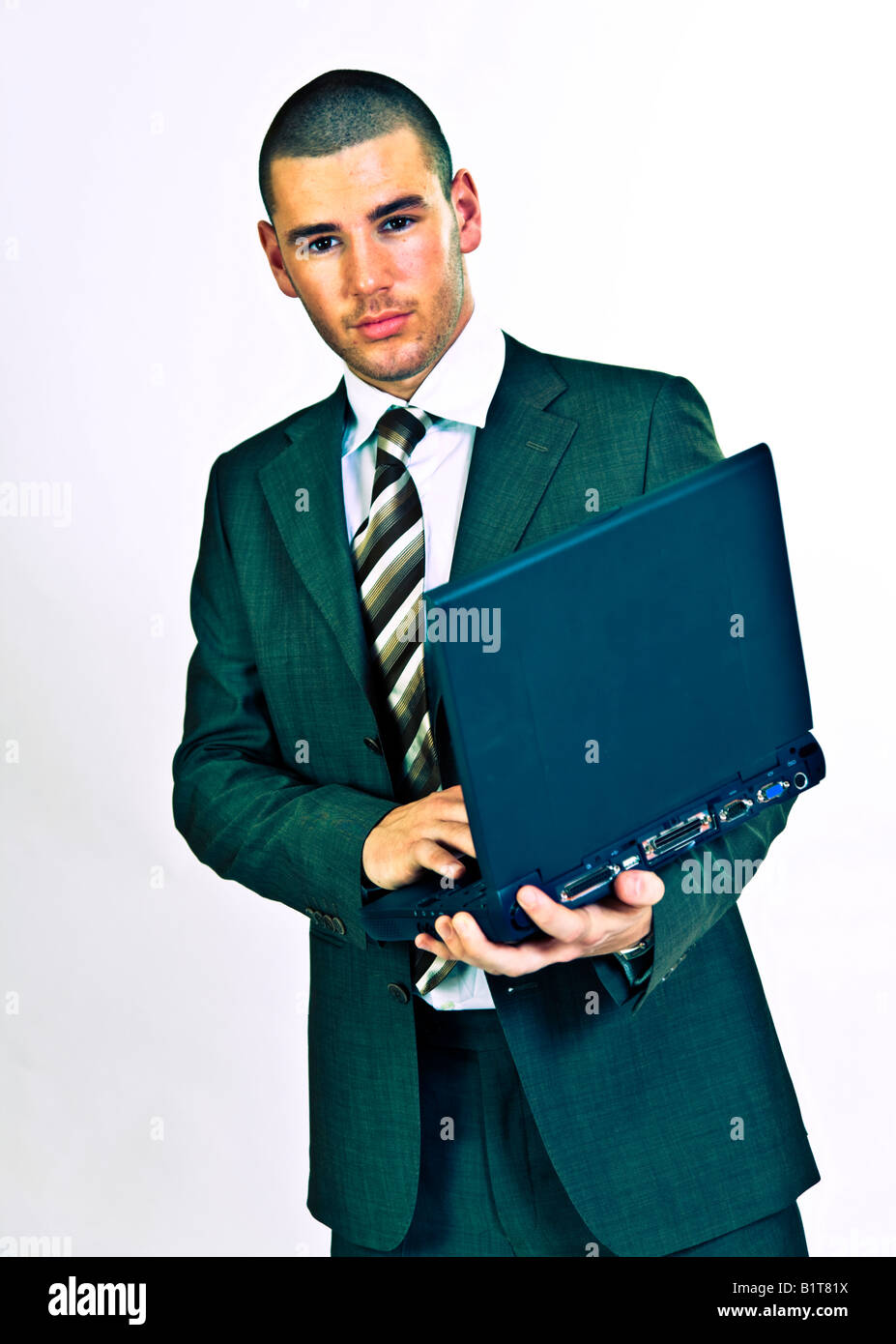 Young businessman using a laptop Stock Photo - Alamy