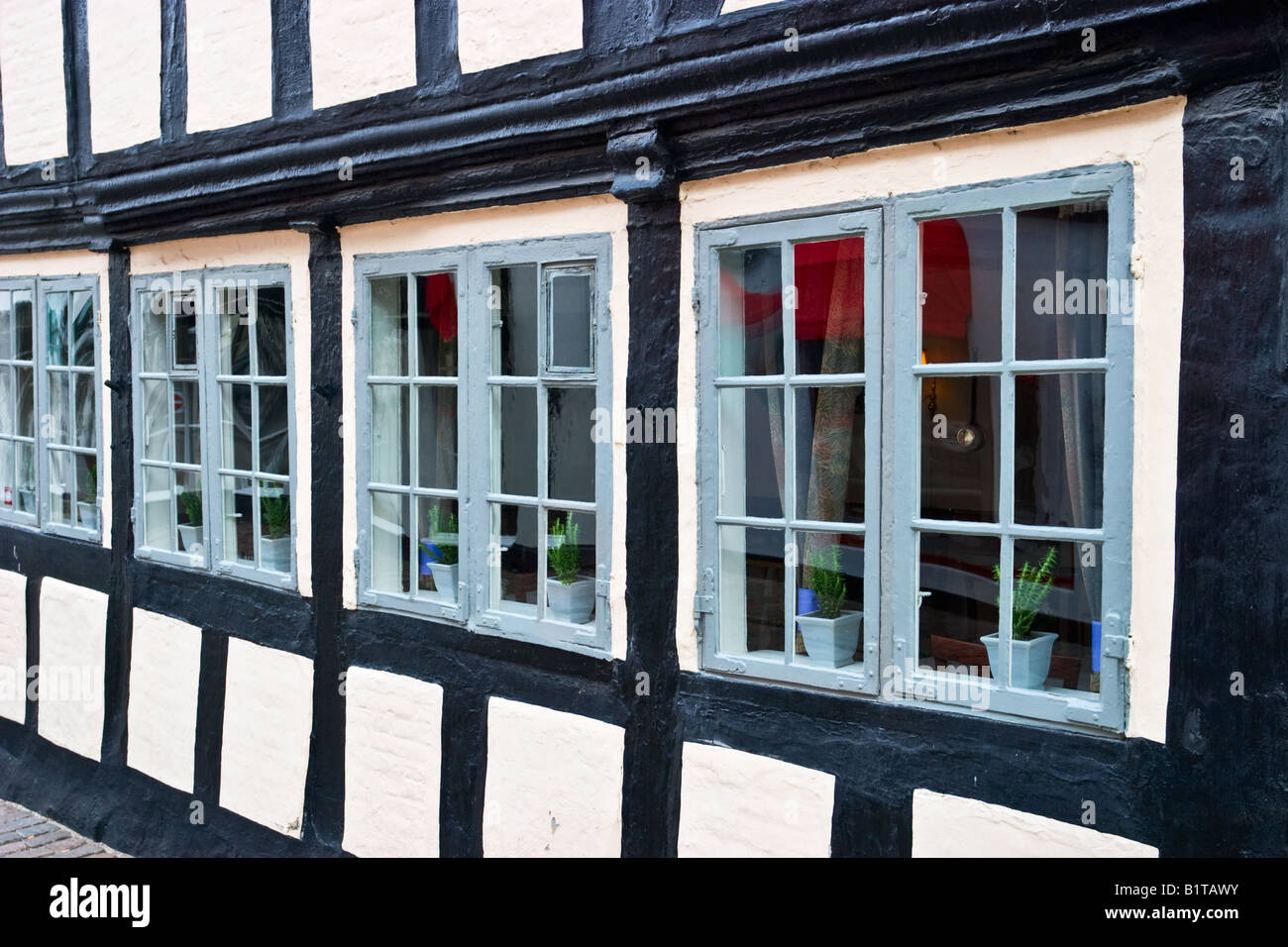 Window row at a half timbered house Stock Photo - Alamy