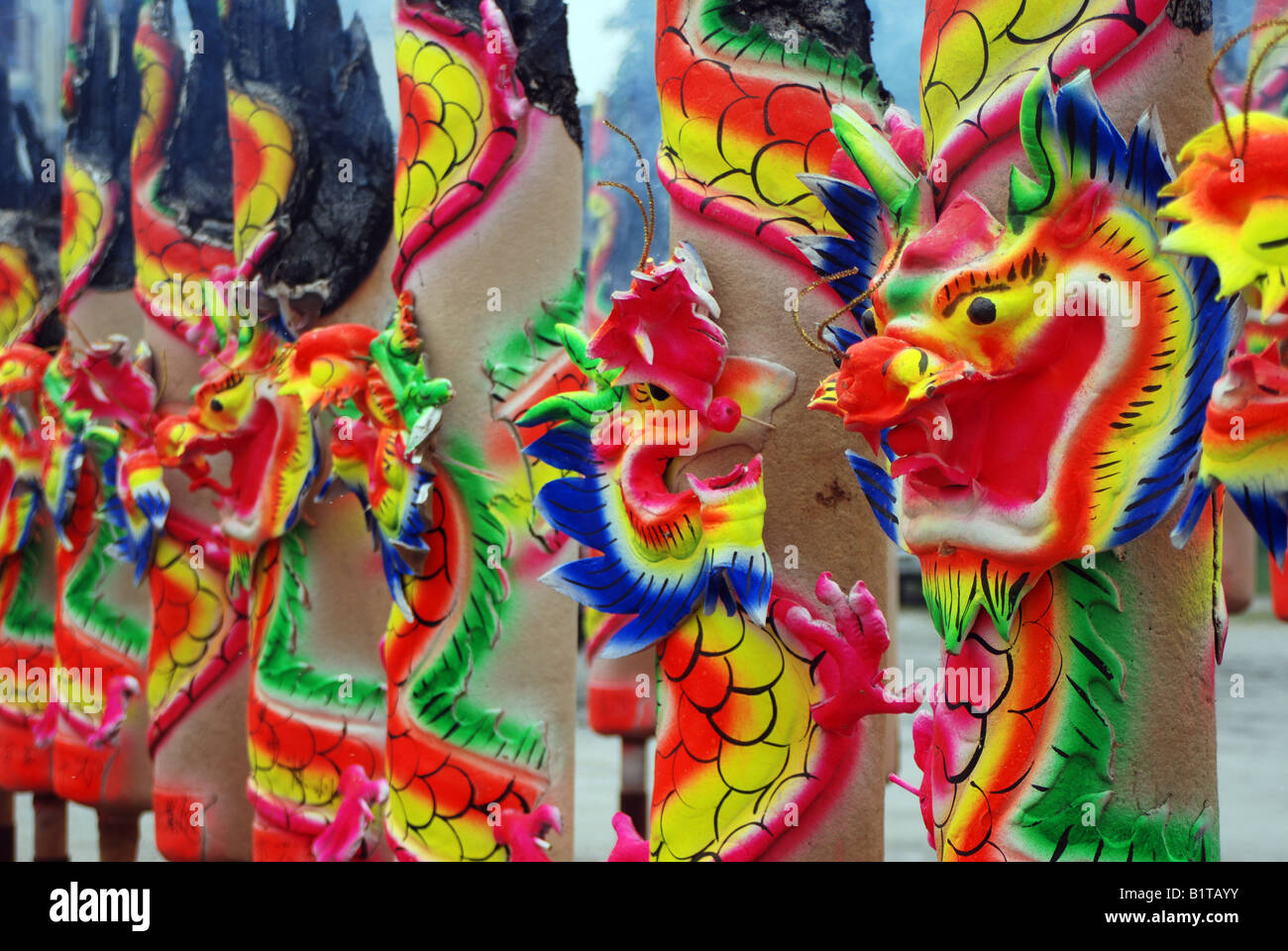 Giant joss sticks with dragon motif Stock Photo - Alamy