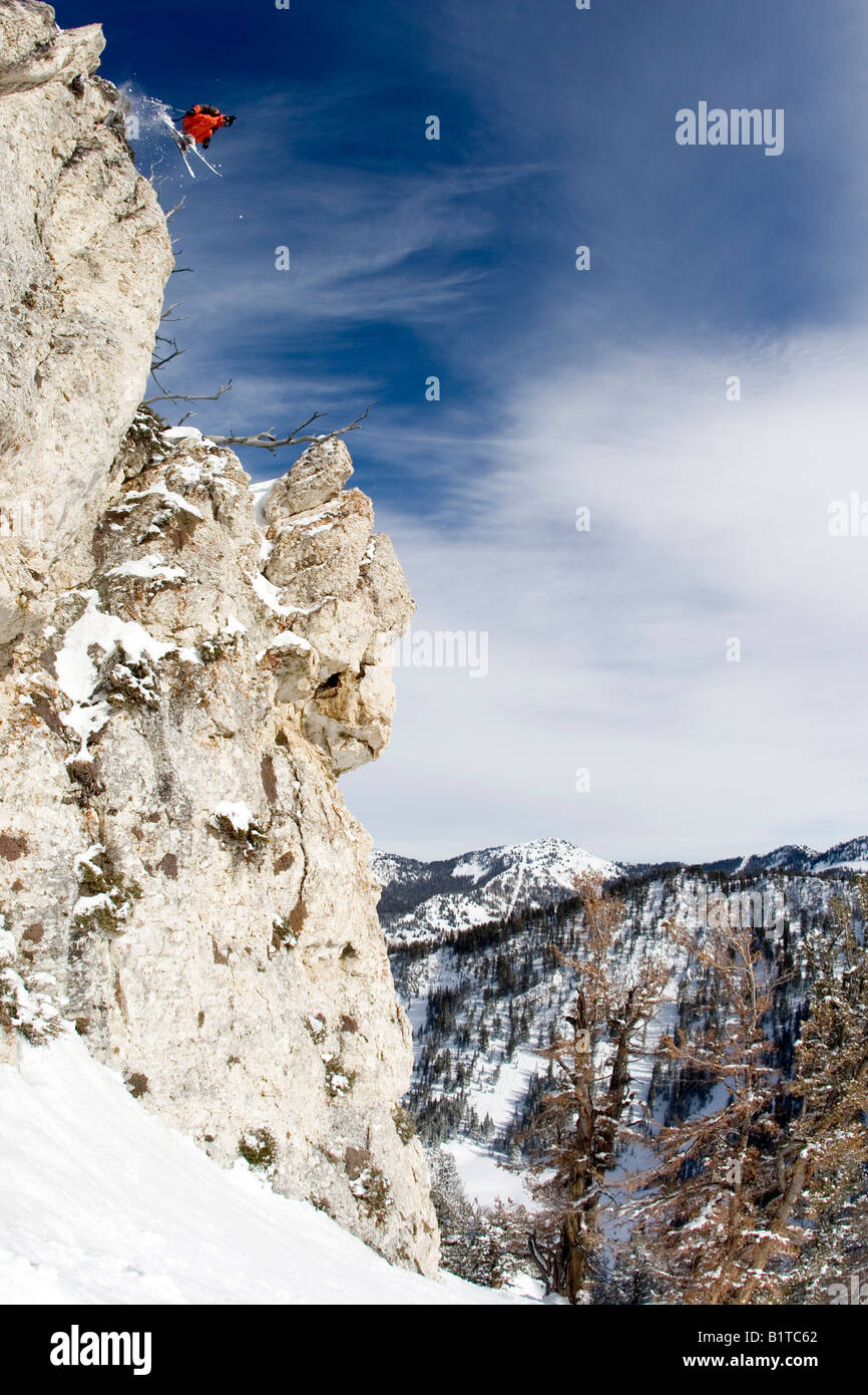 skier jumping from high ledge Stock Photo - Alamy