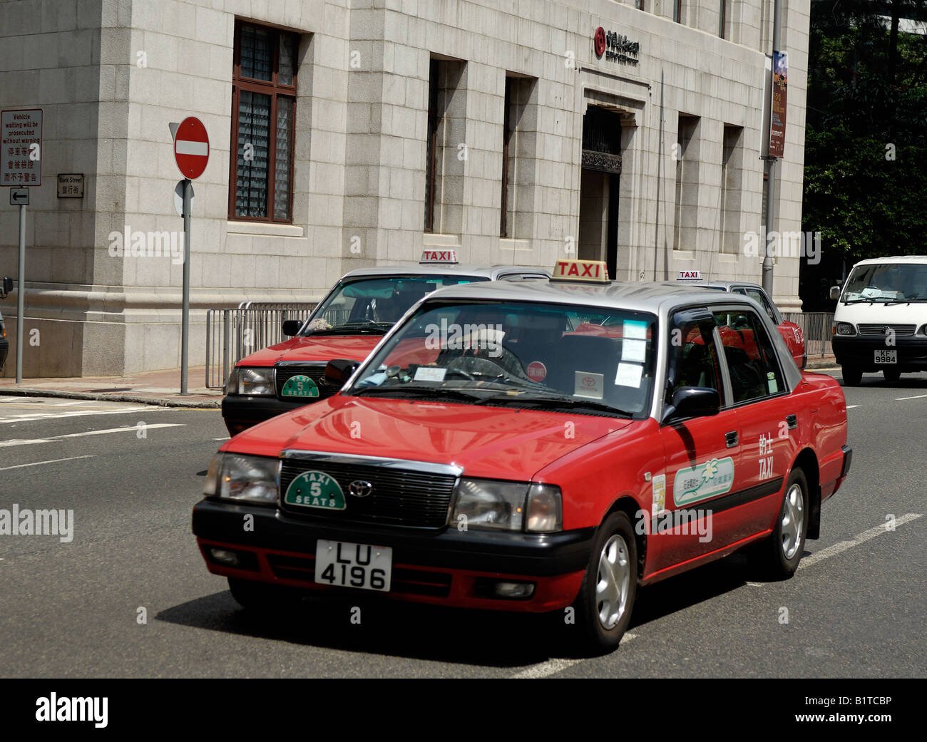 Hong Kong's distinctive red cabs Stock Photo - Alamy