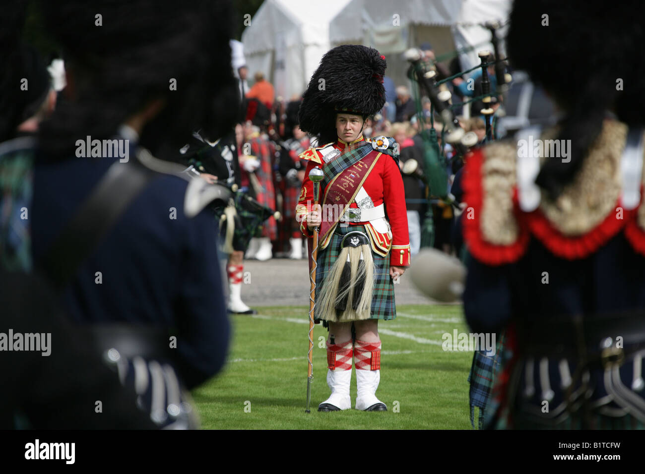 Village of Braemar, Scotland. Female Pipe Major leading her band in the ...