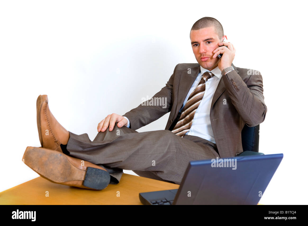 Man telephone office feet desk hi-res stock photography and images - Alamy
