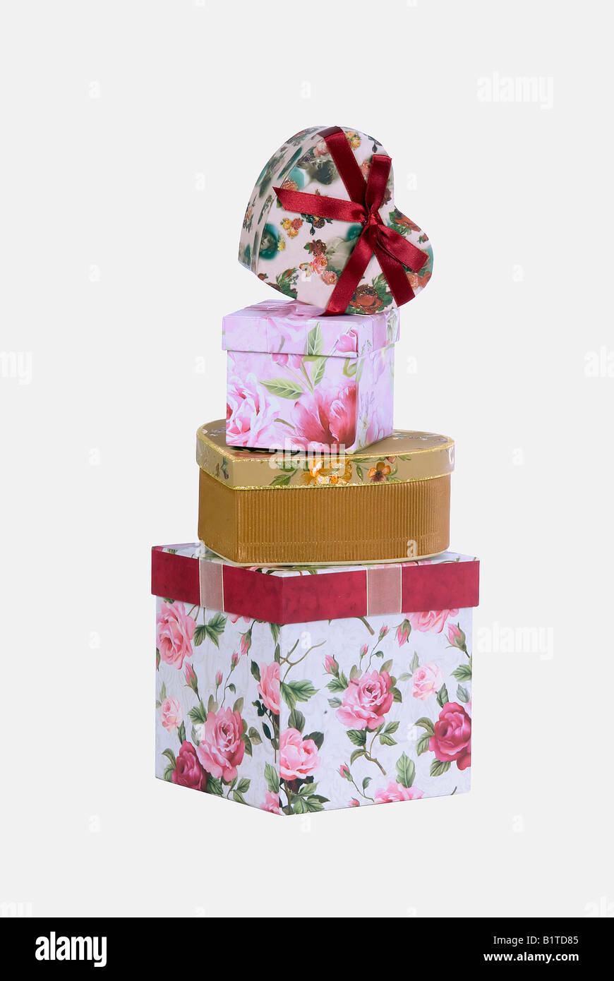 Four presents in a pile two of them are heart shape Stock Photo - Alamy
