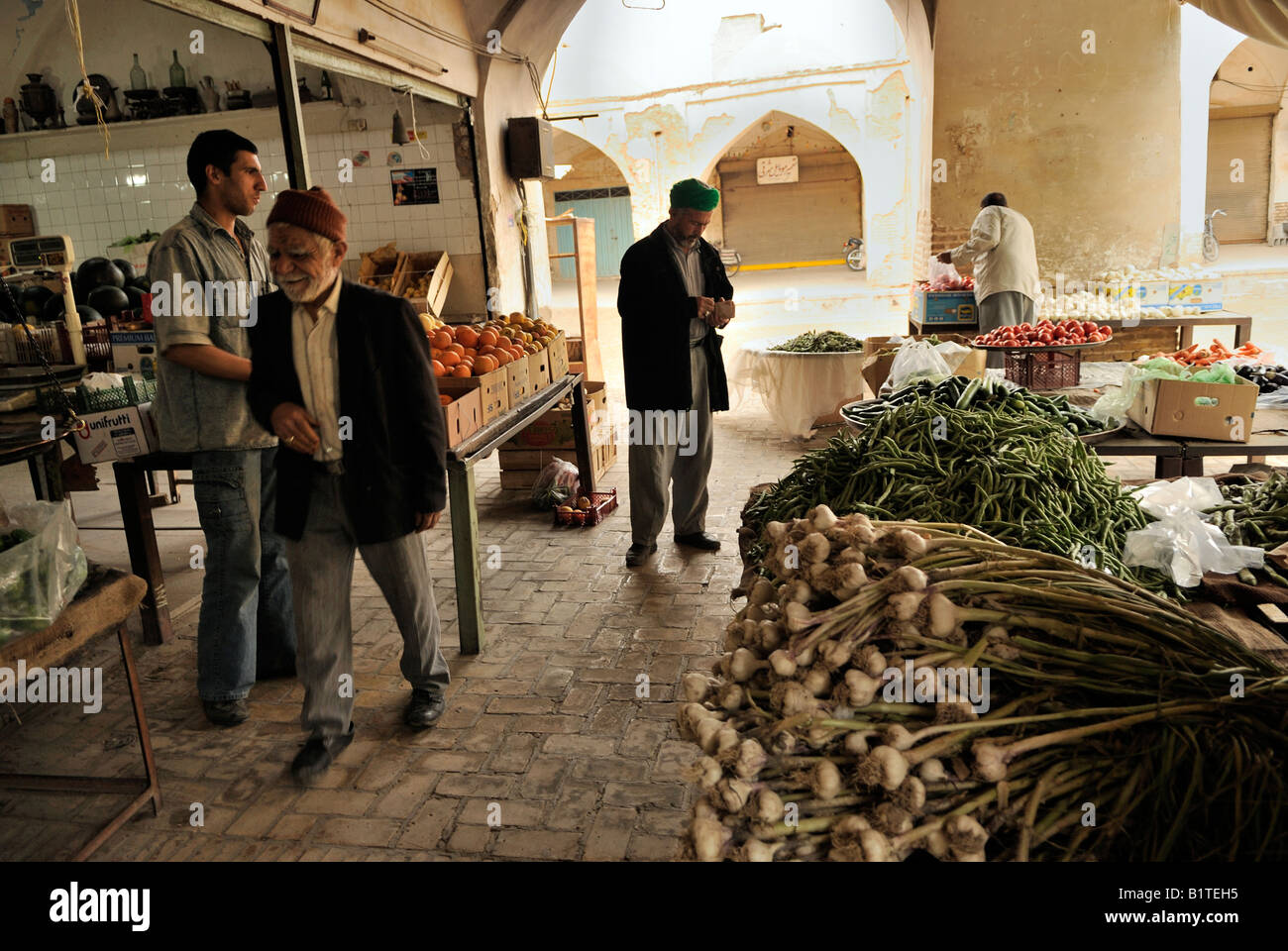 Men shopping for fruit and vegitables in the old market sector of Yazd ...