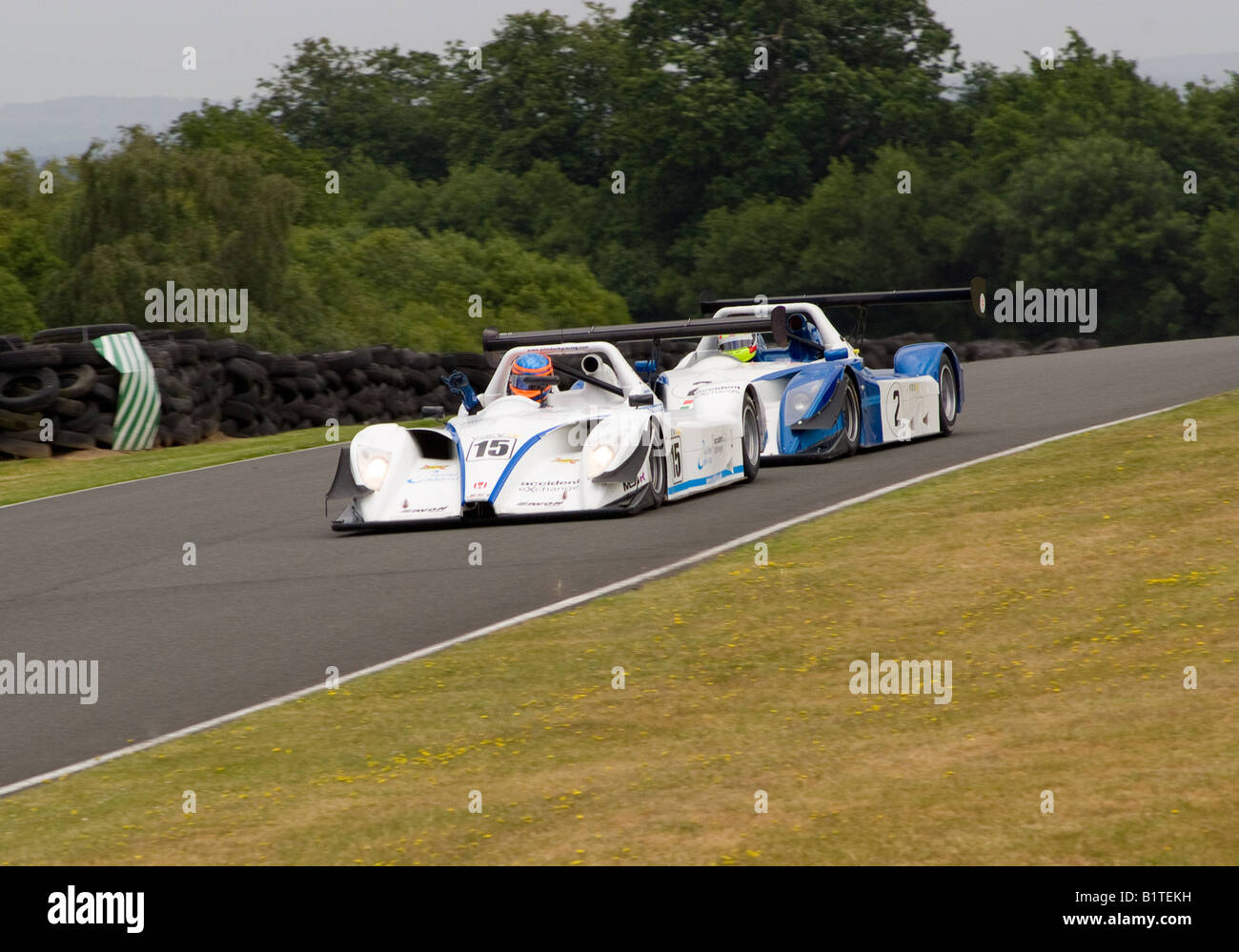 Two V de V Ligier JS49 Sports Cars Drop Down Hill Top at Oulton Park ...