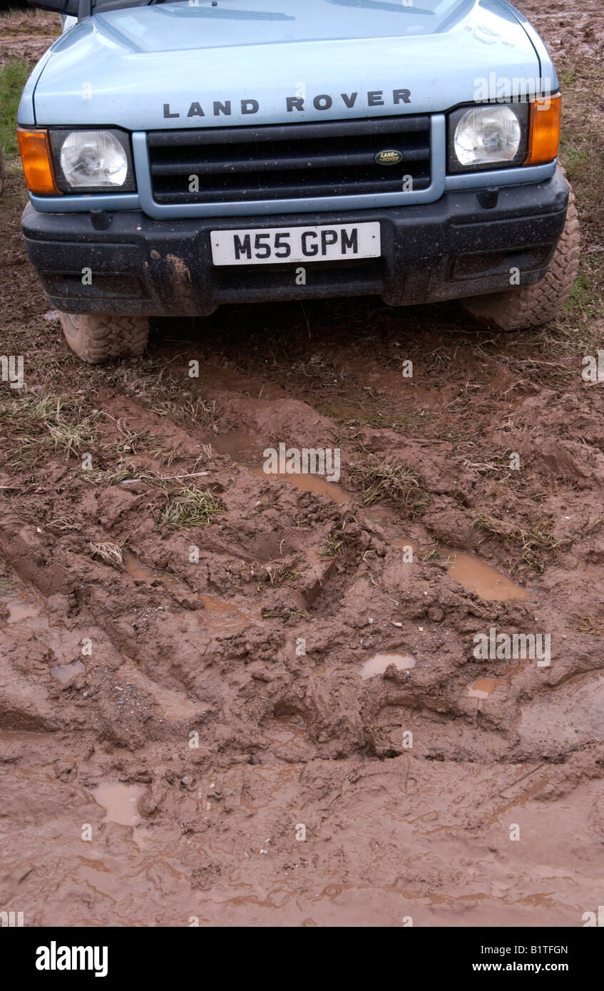 Land Rover Discovery in muddy car park at The Guardian Hay Festival ...