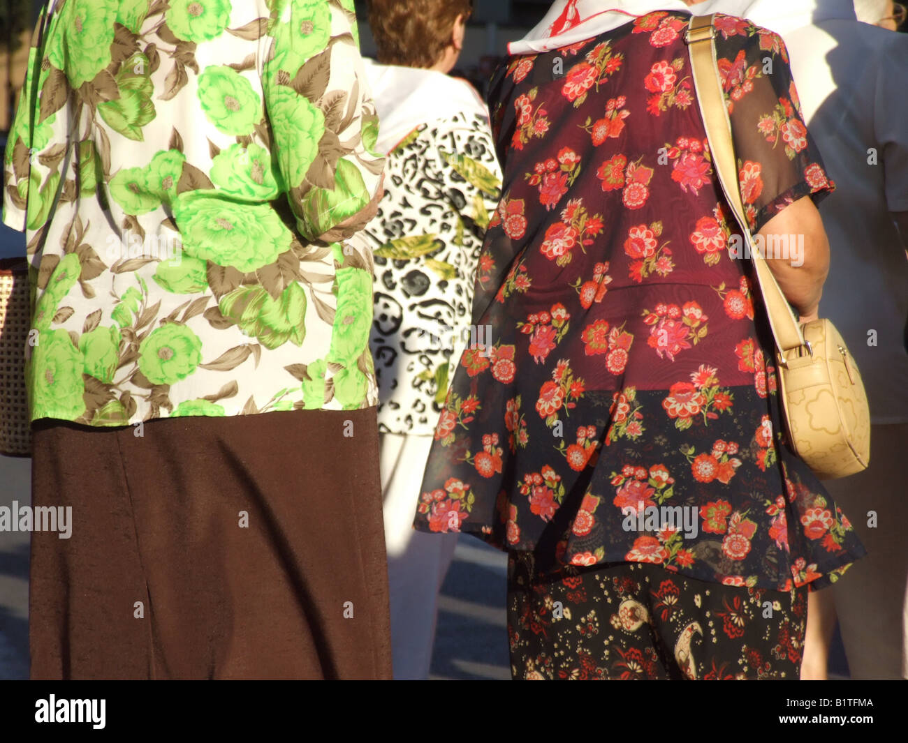old women wearing floral design dresses in town Stock Photo - Alamy