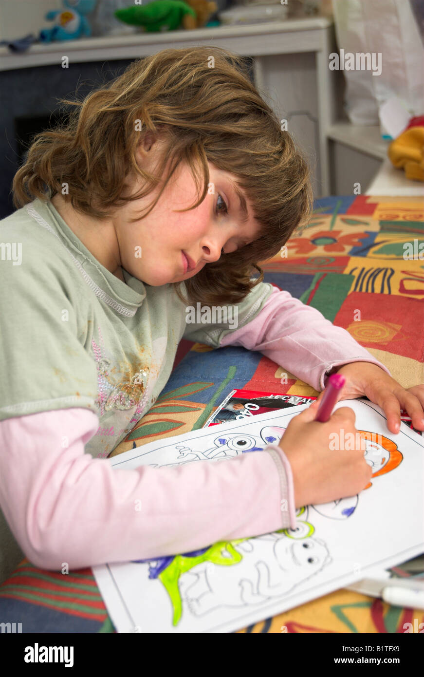 Girl Colouring in a Picture Stock Photo - Alamy