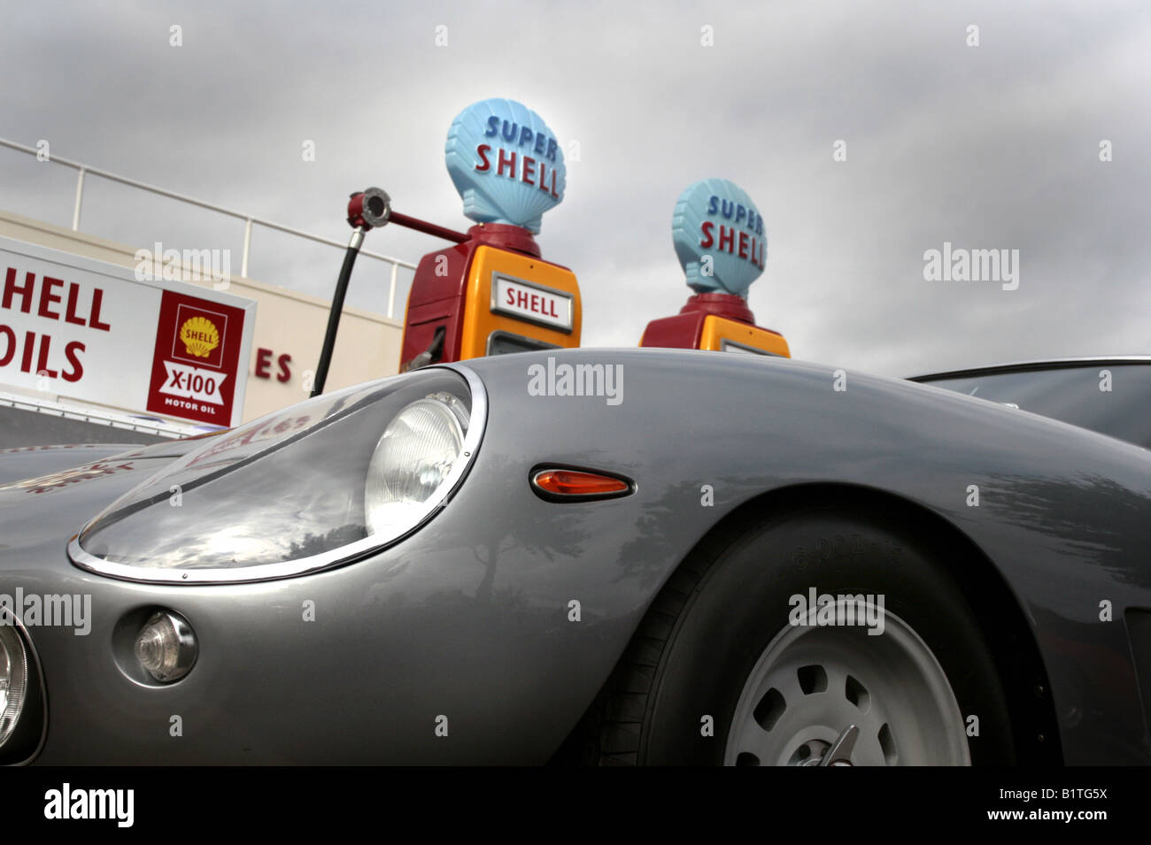 A Ferrari Pulls into a Shell garage to fill up with petrol Stock Photo ...