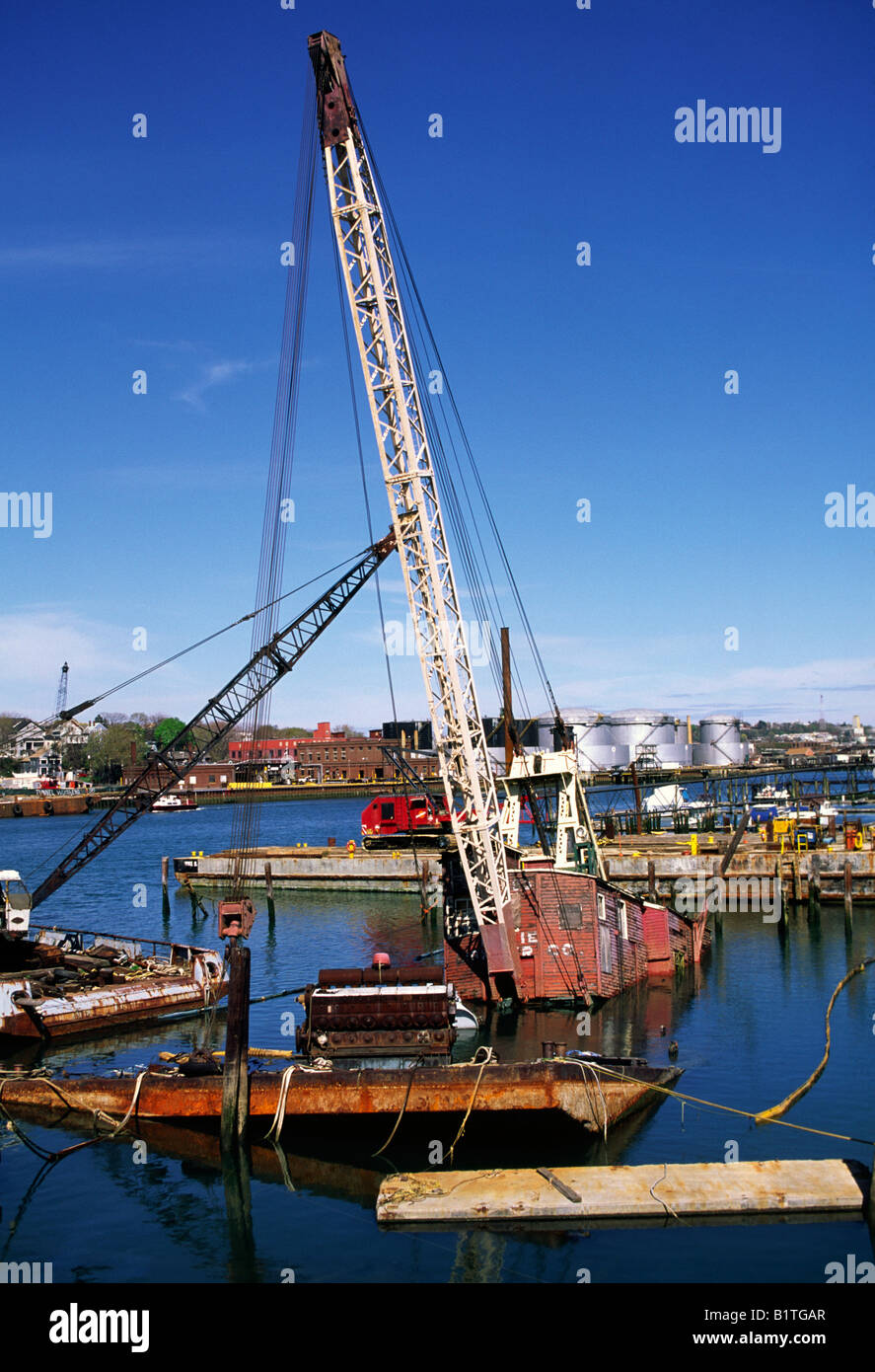 Sunken barge and crane, Boston Harbor Stock Photo - Alamy