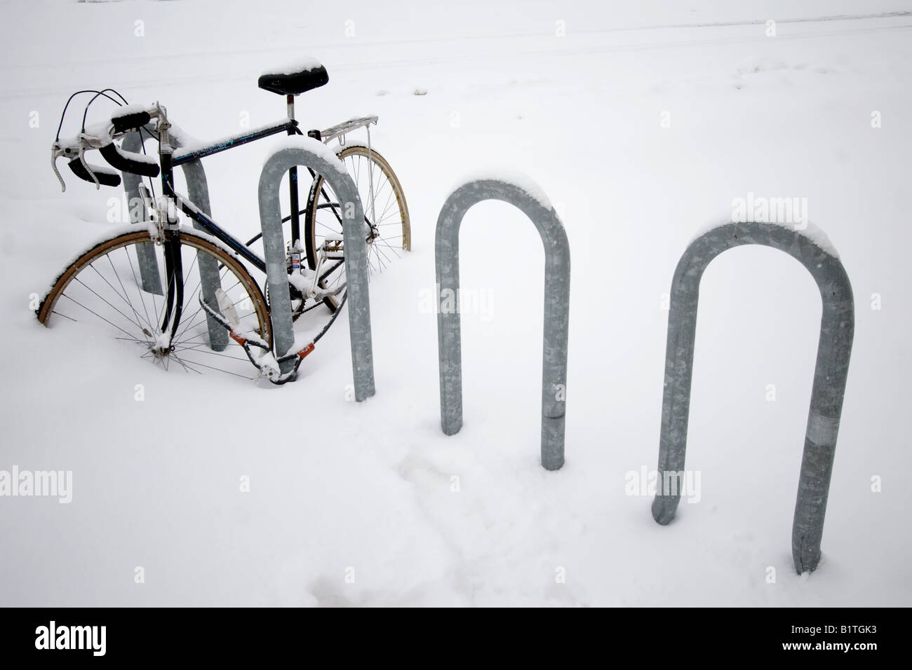 A bicycle is buried in snow from a large snowstorm in suburban Chicago ...