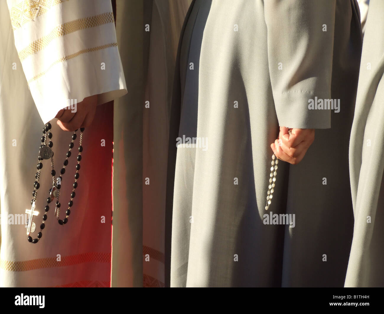 priest holding rosaries in street road in rome italy Stock Photo - Alamy