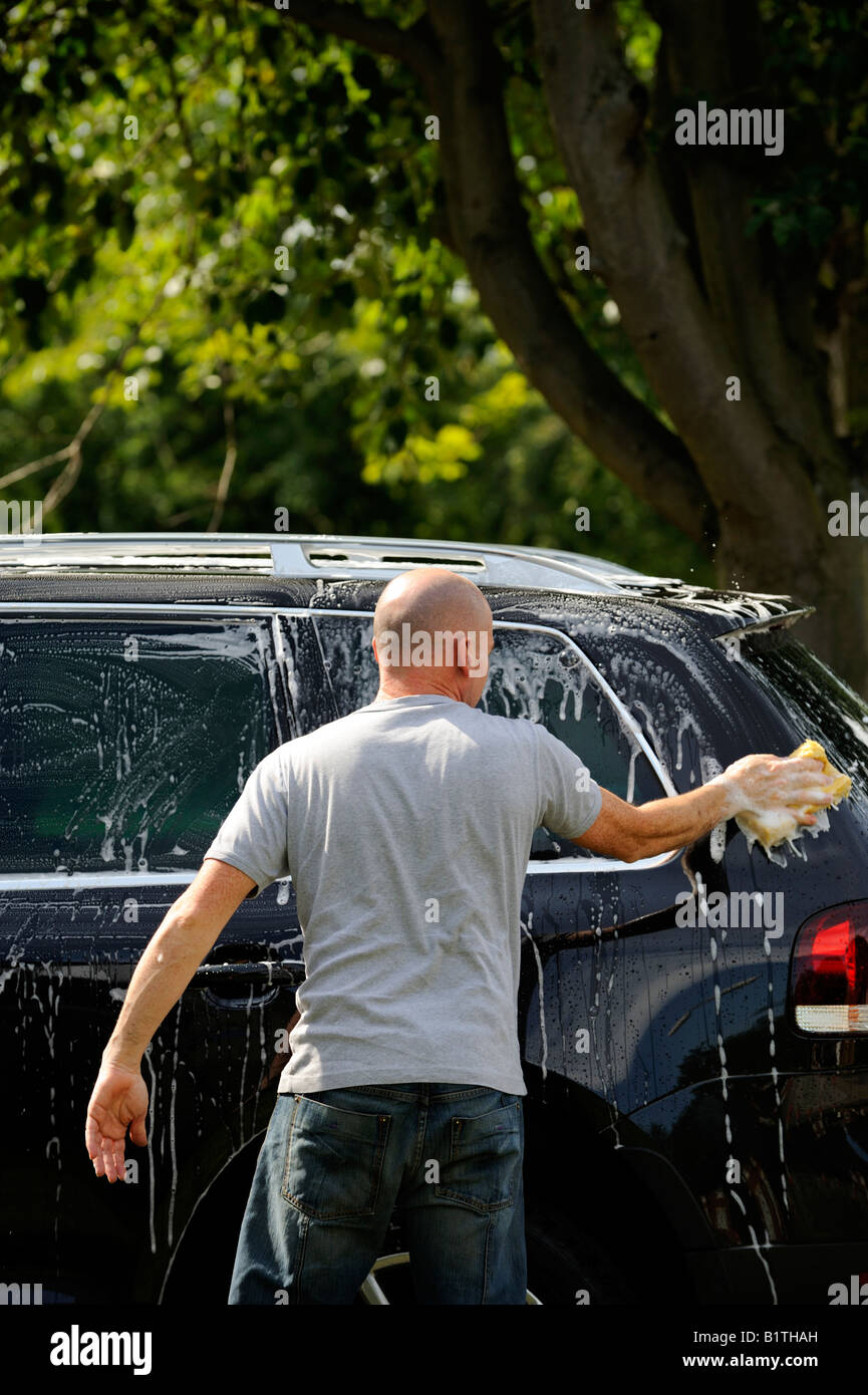 Man washing car Stock Photo - Alamy