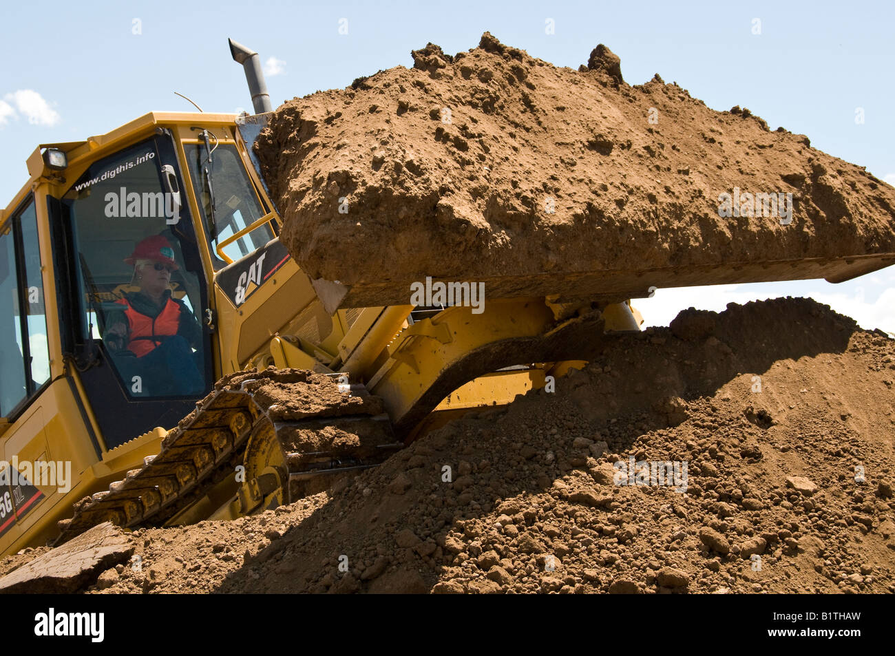 Woman at the controls of a D5G Caterpillar bulldozer, Dig This ...