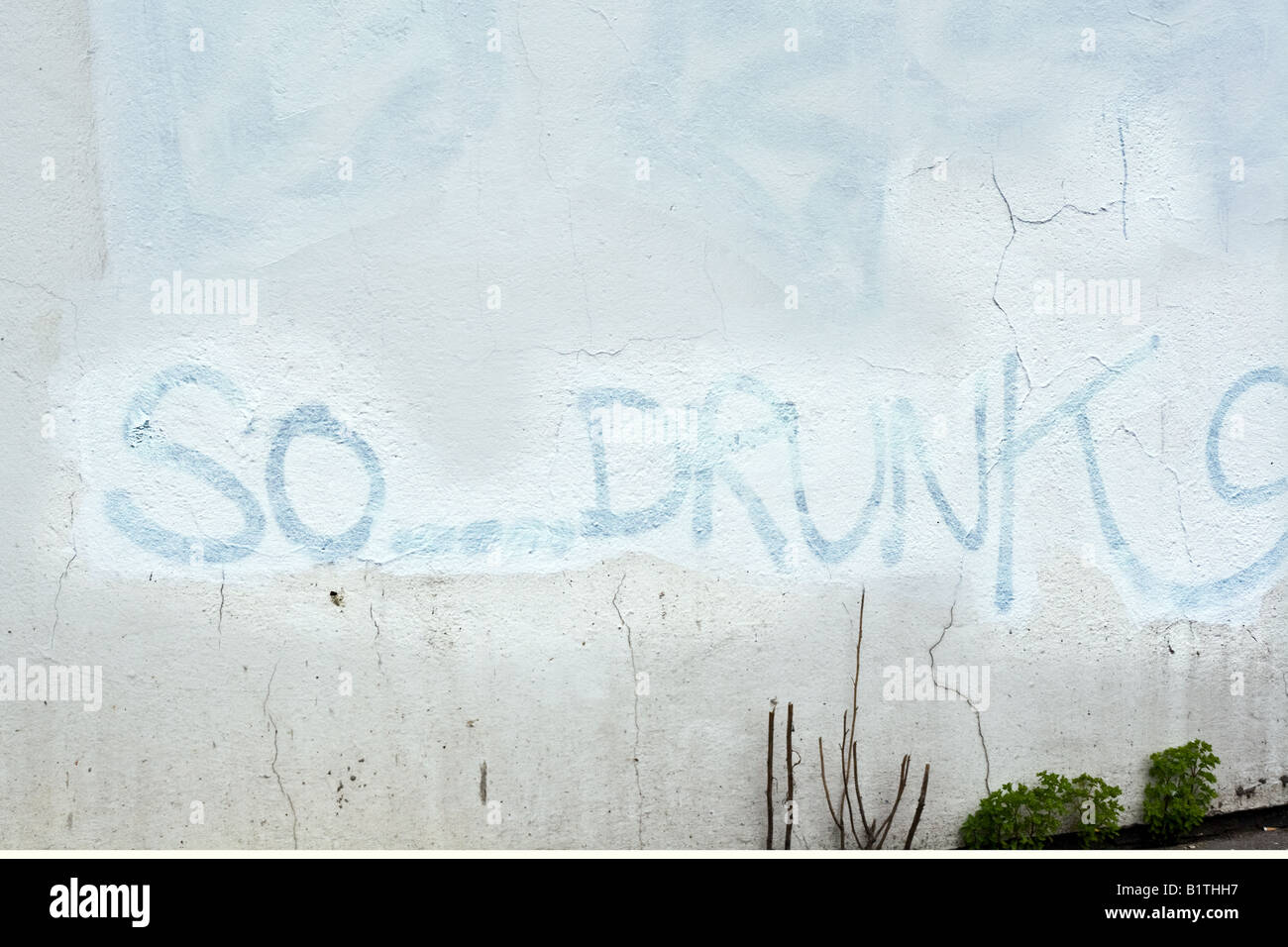 Graffiti painted over on inner city wall Stock Photo - Alamy