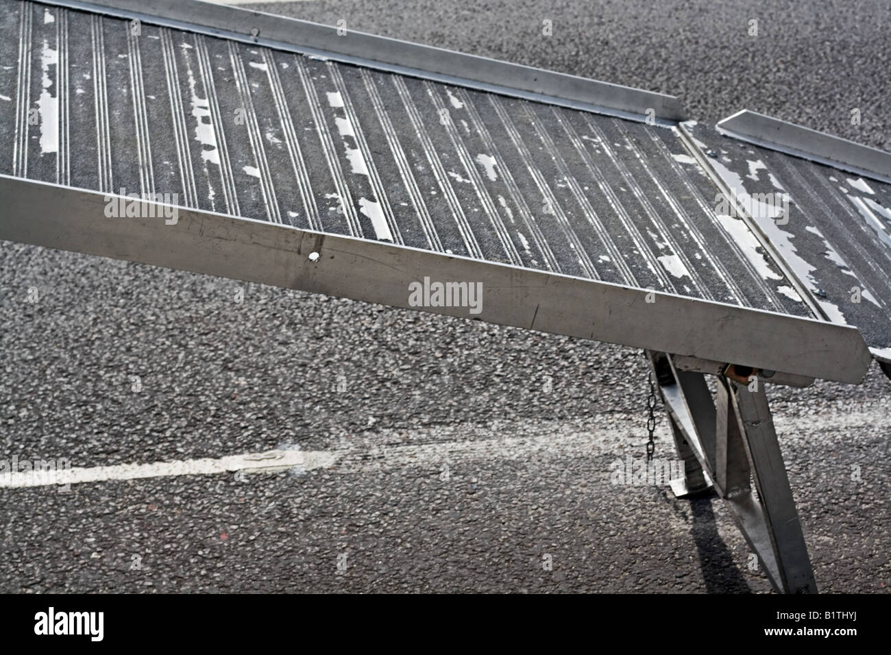 Metal ramp attached to the back of a lorry Stock Photo - Alamy