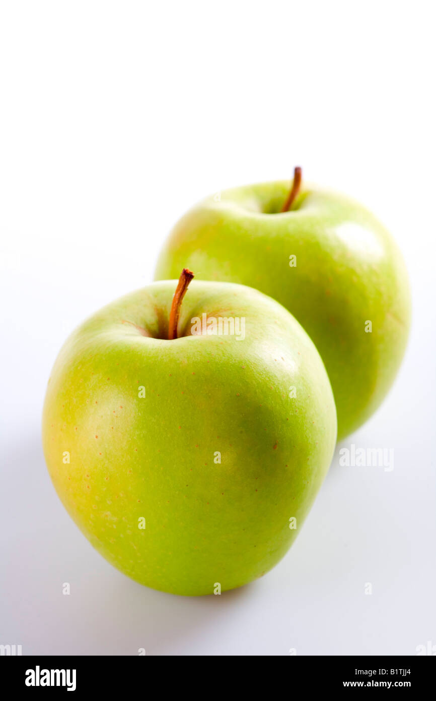 two green apples on white background with shadows Stock Photo - Alamy