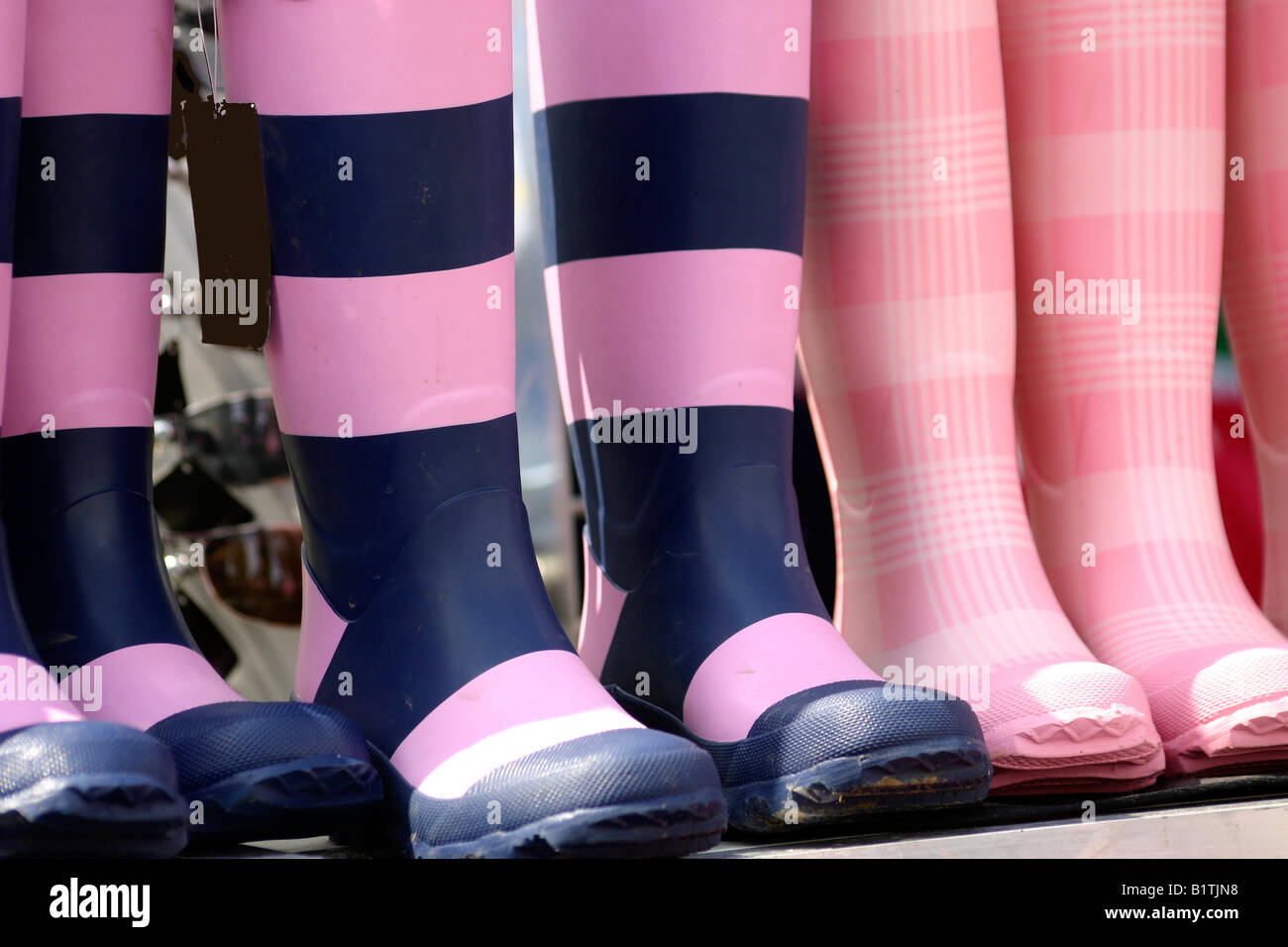 Brightly colored wellington boots on display at a country fair Stock ...