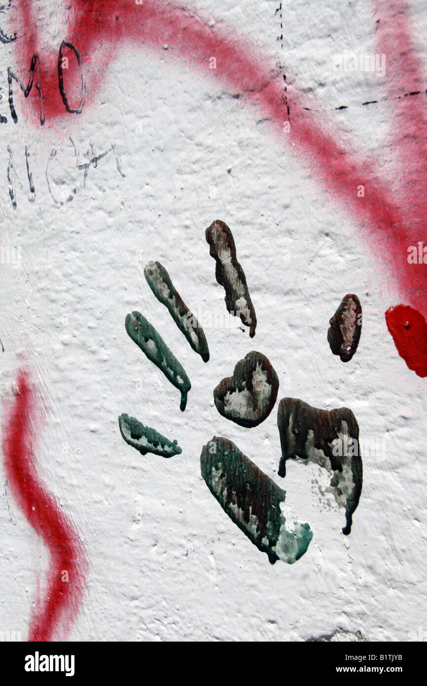 hand print painted graffiti on wall in town Stock Photo - Alamy