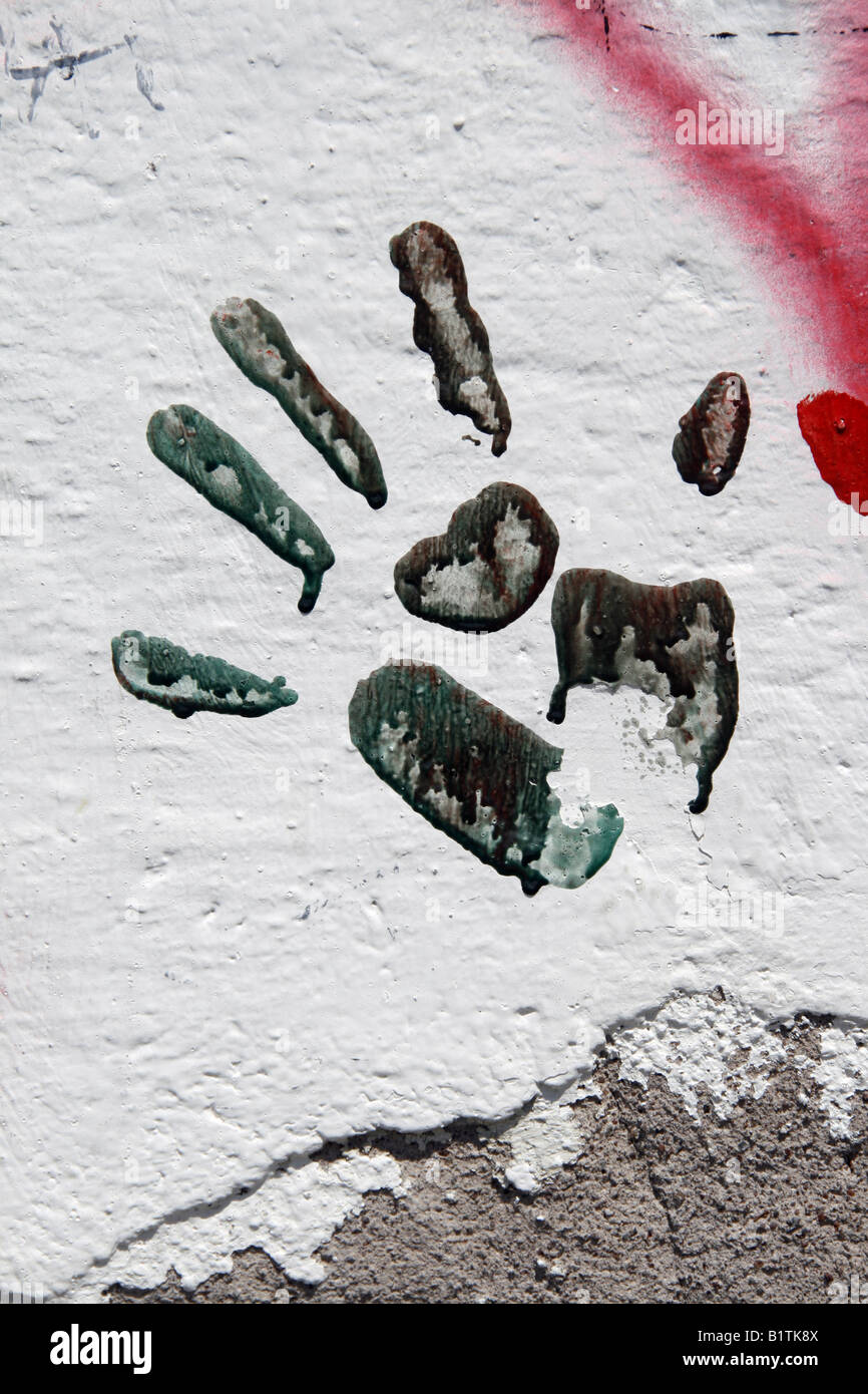 hand print painted graffiti on wall in town Stock Photo - Alamy